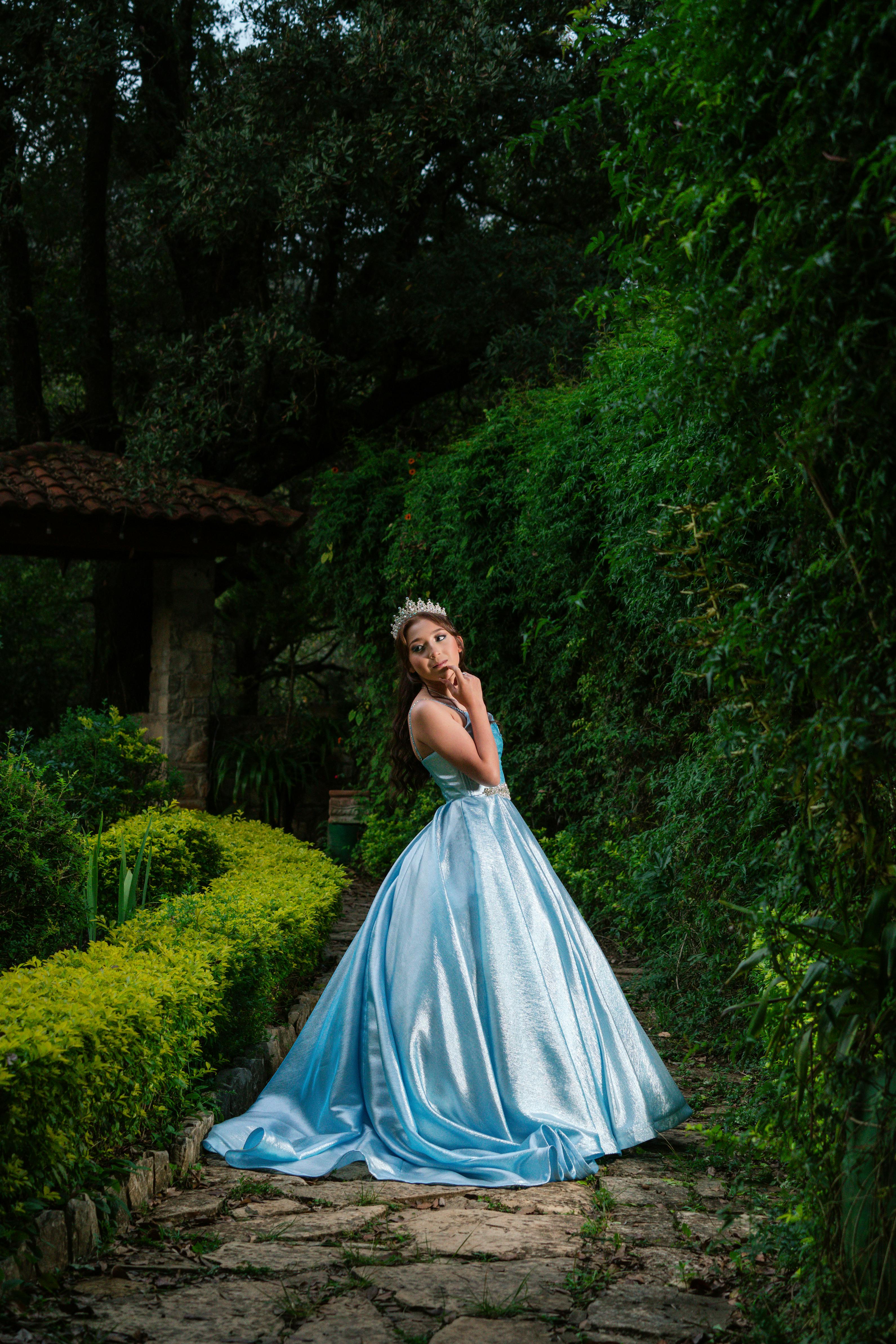 Woman in a Princess Dress Standing on a Garden Path · Free Stock Photo