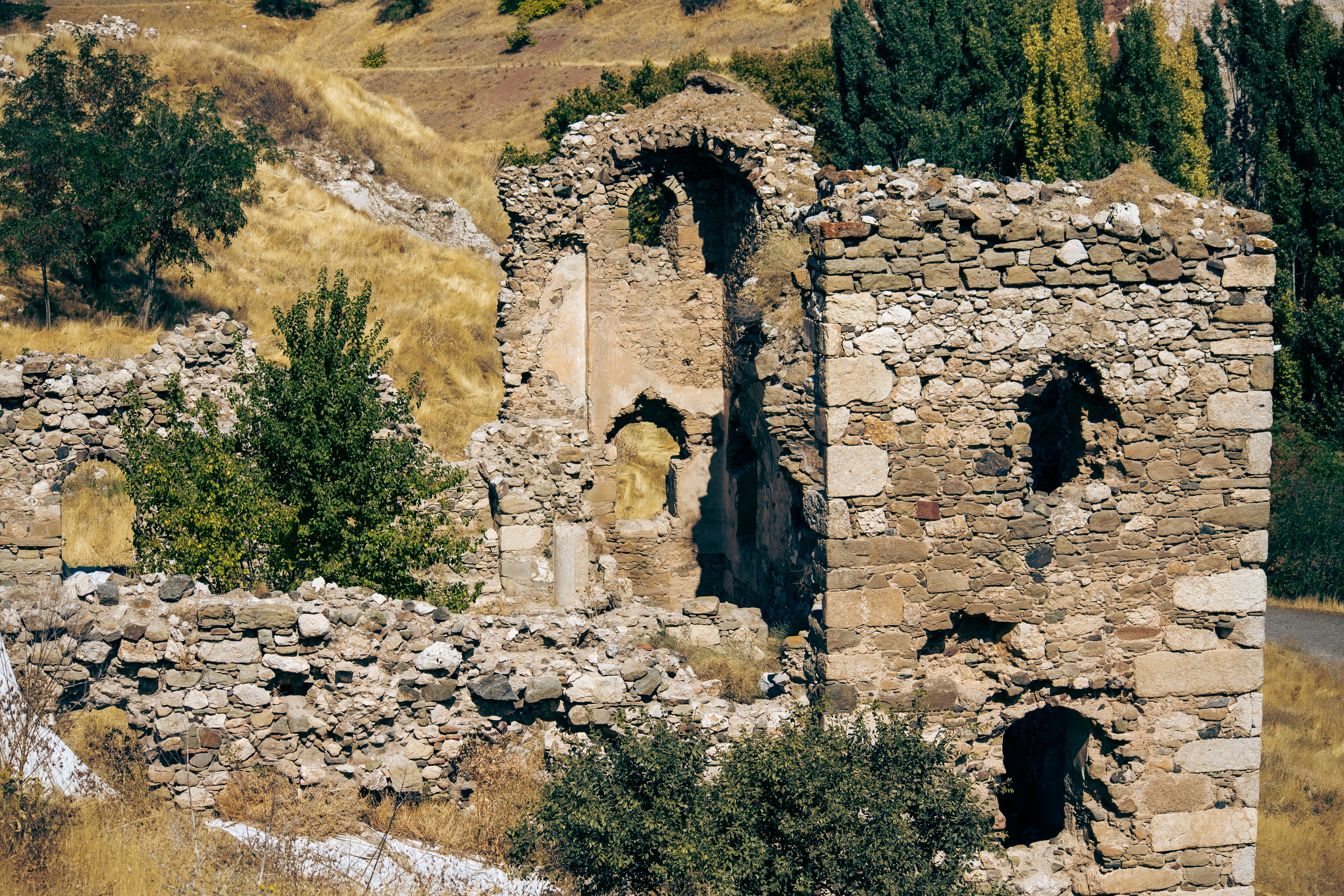 Stone Castle Ruins on Green Hills · Free Stock Photo