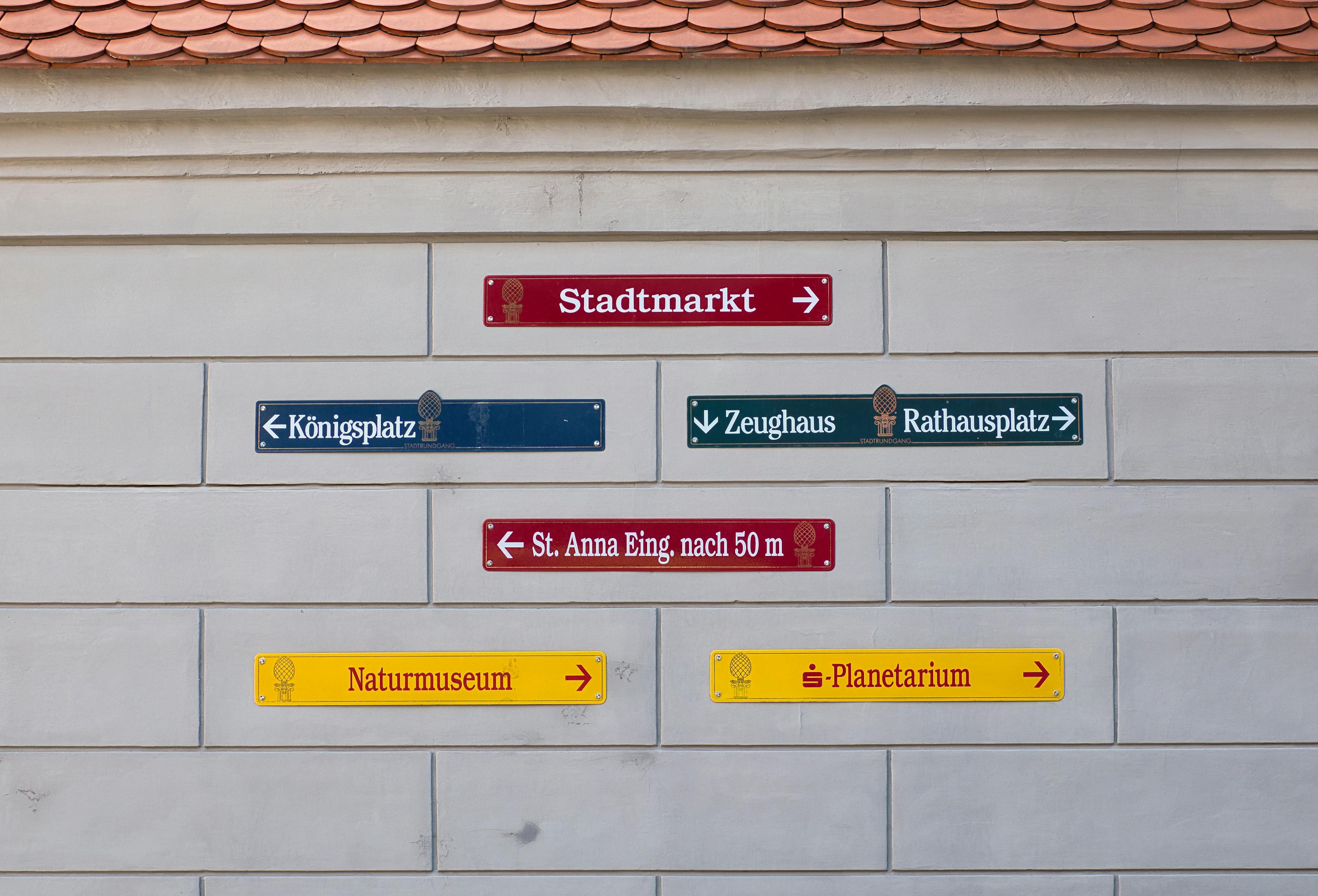Directional Signs on Wall · Free Stock Photo