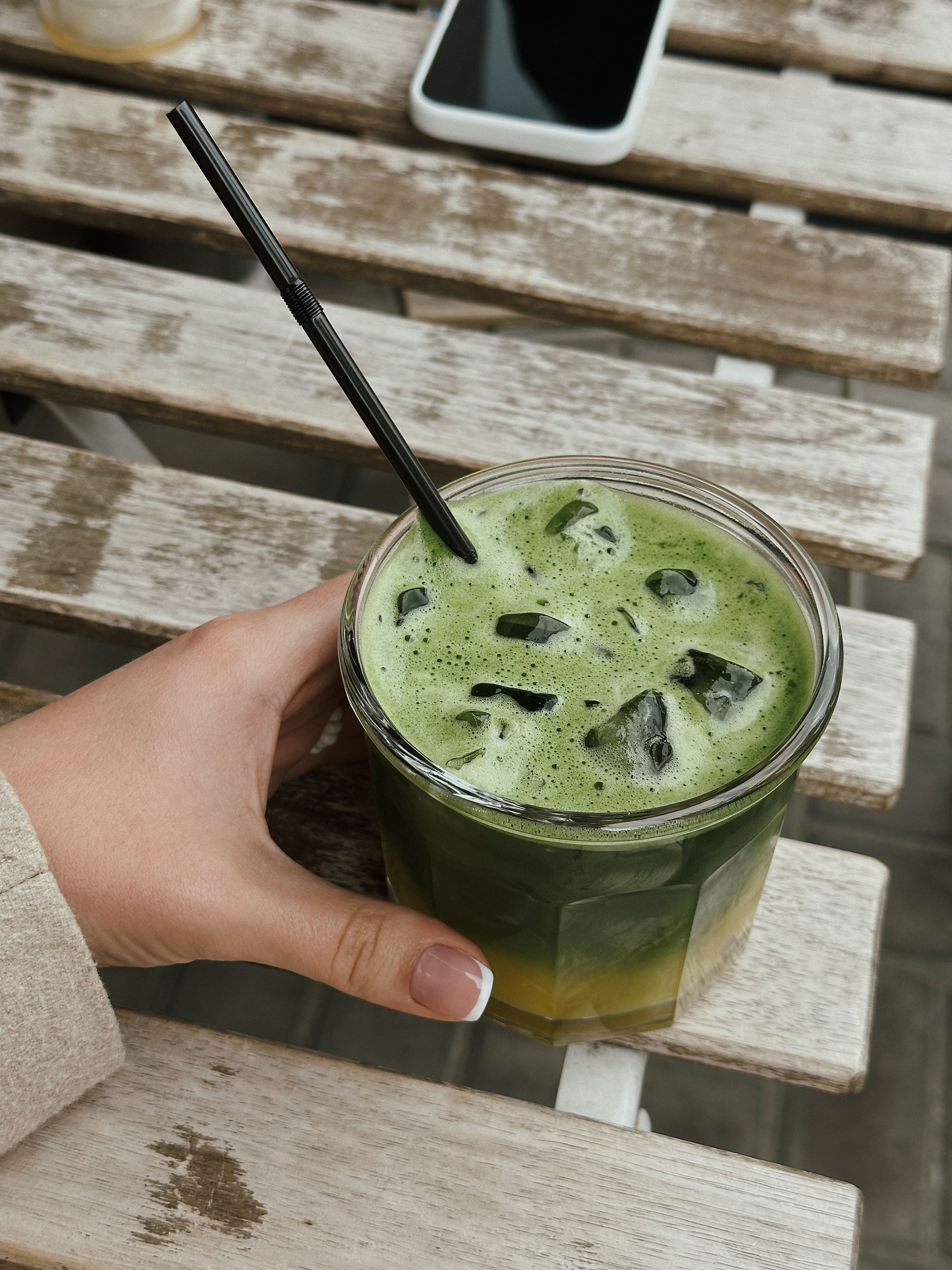 Close-up of Woman Drinking Matcha in Glass · Free Stock Photo