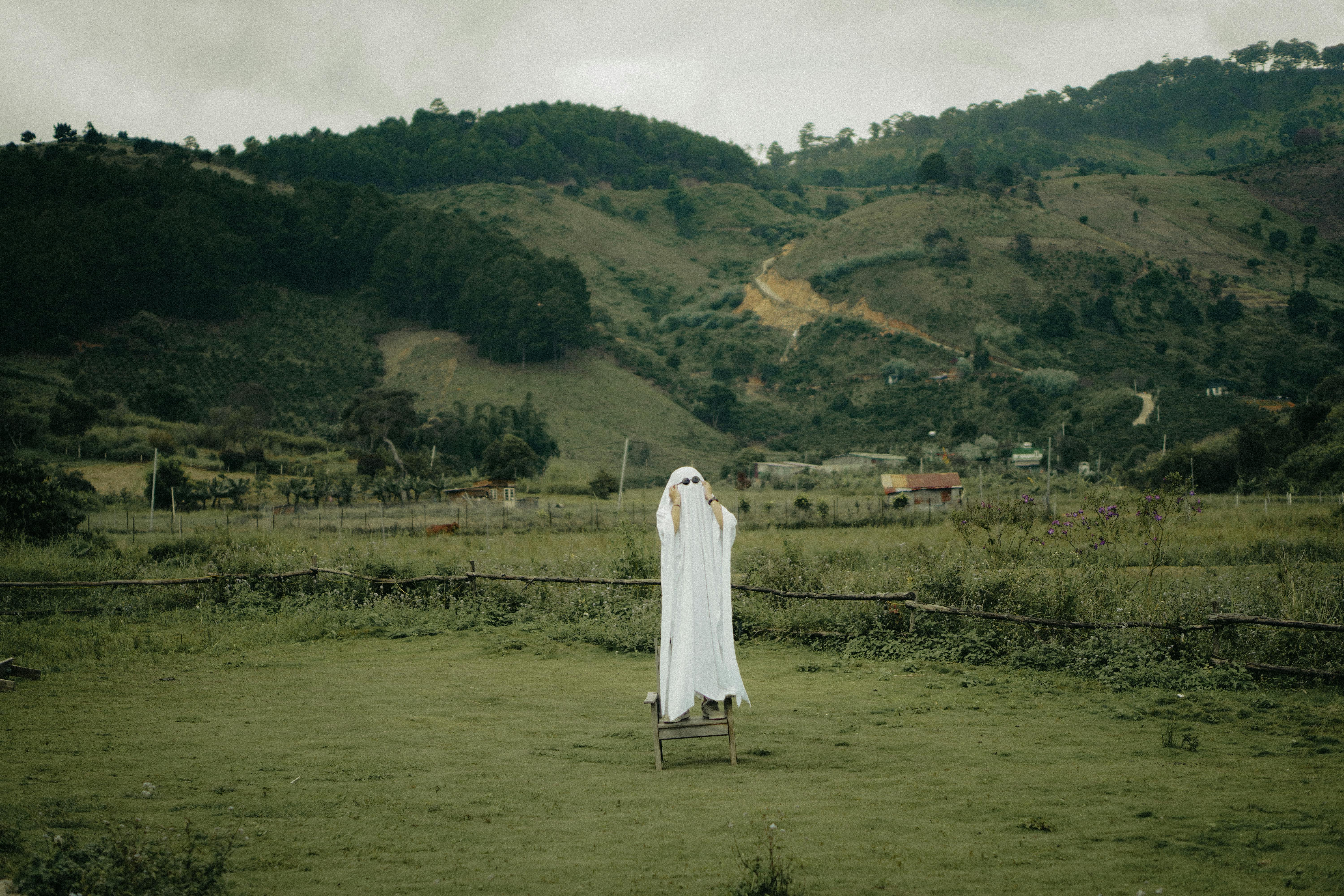 Ghost Standing on Chair in Countryside · Free Stock Photo