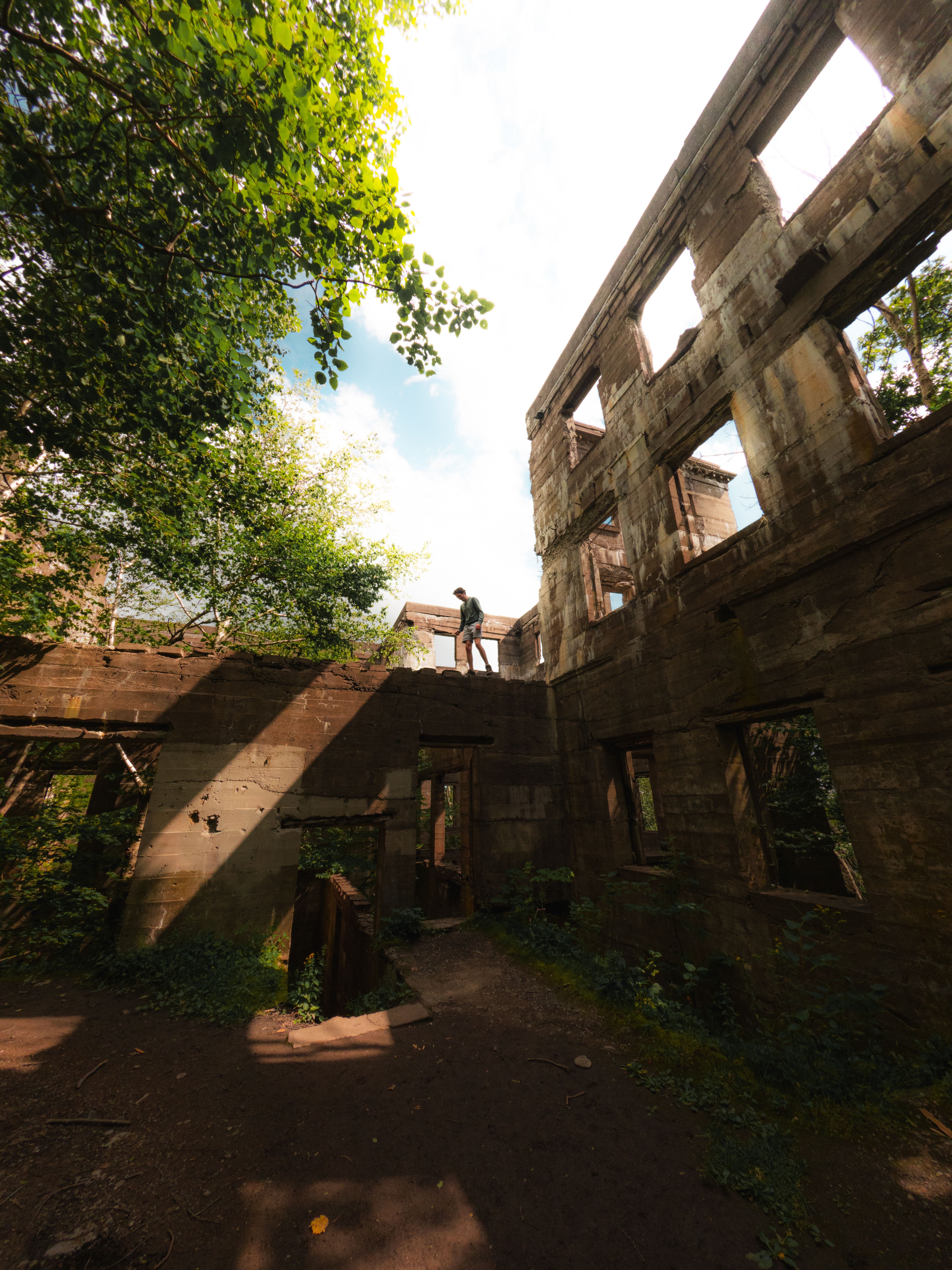 A Man Walking on Building Ruins · Free Stock Photo