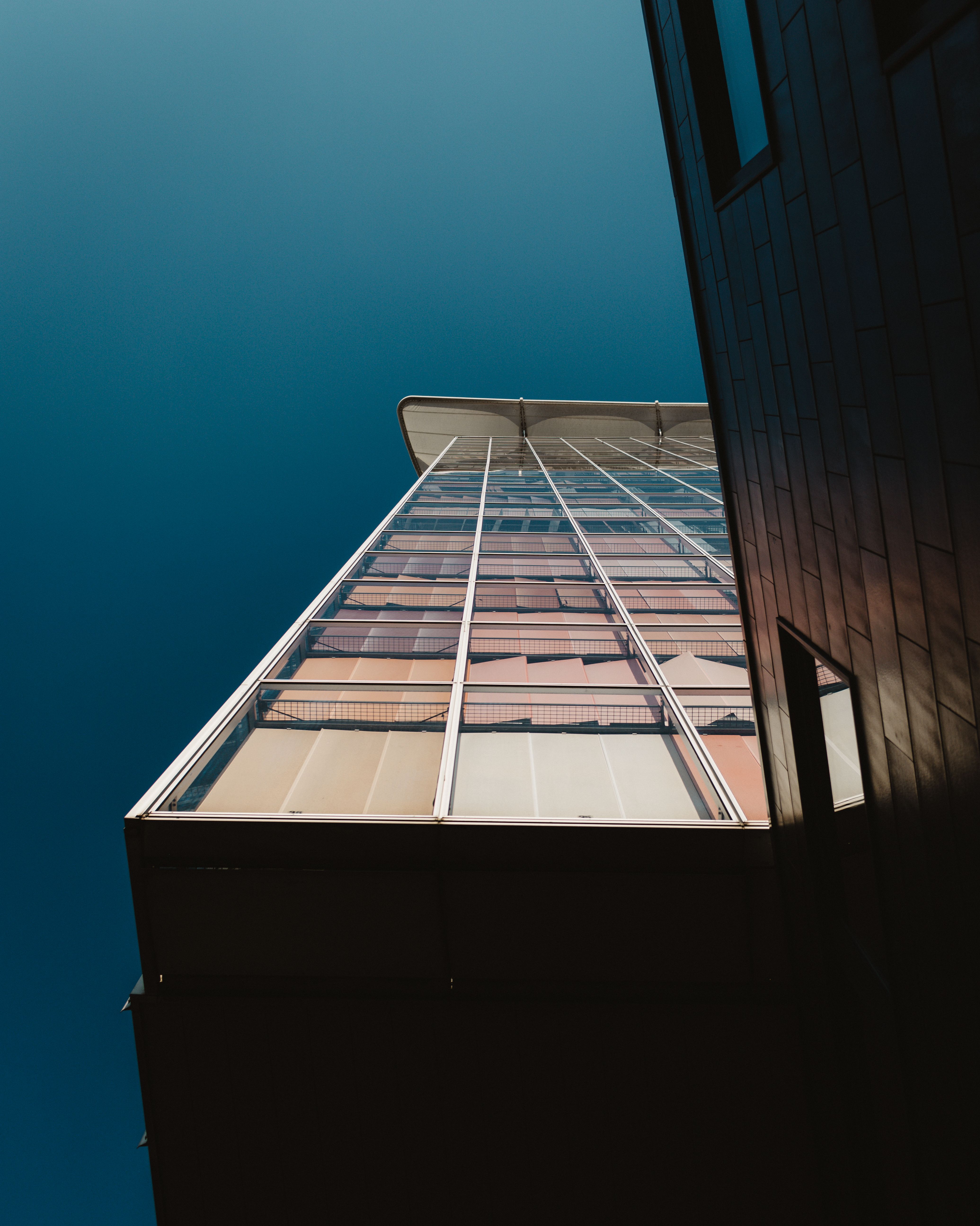 Low Angle View of a Glass Building Wall · Free Stock Photo
