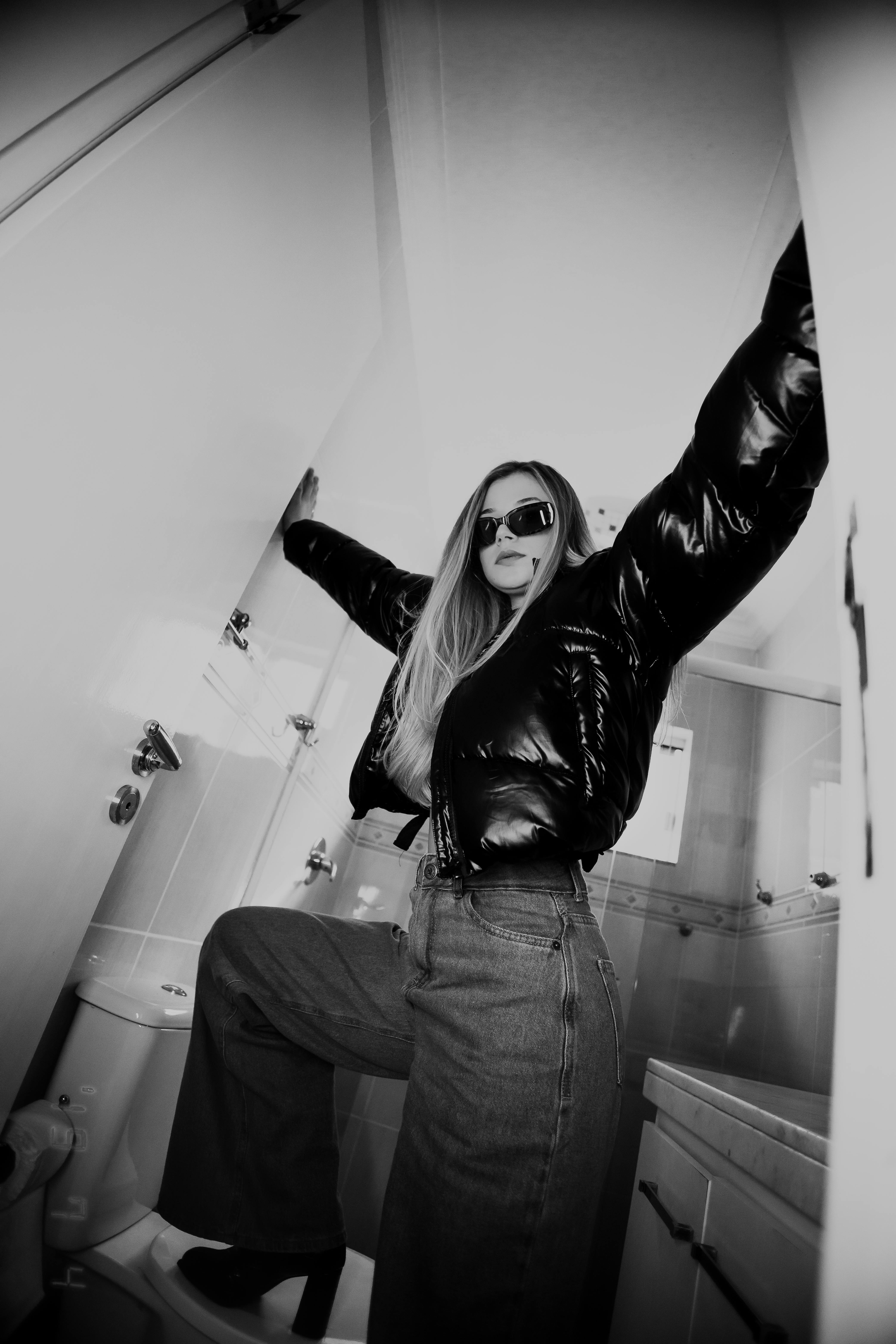 Female Model Wearing a Padded Jacket Posing in a Bathroom · Free Stock ...