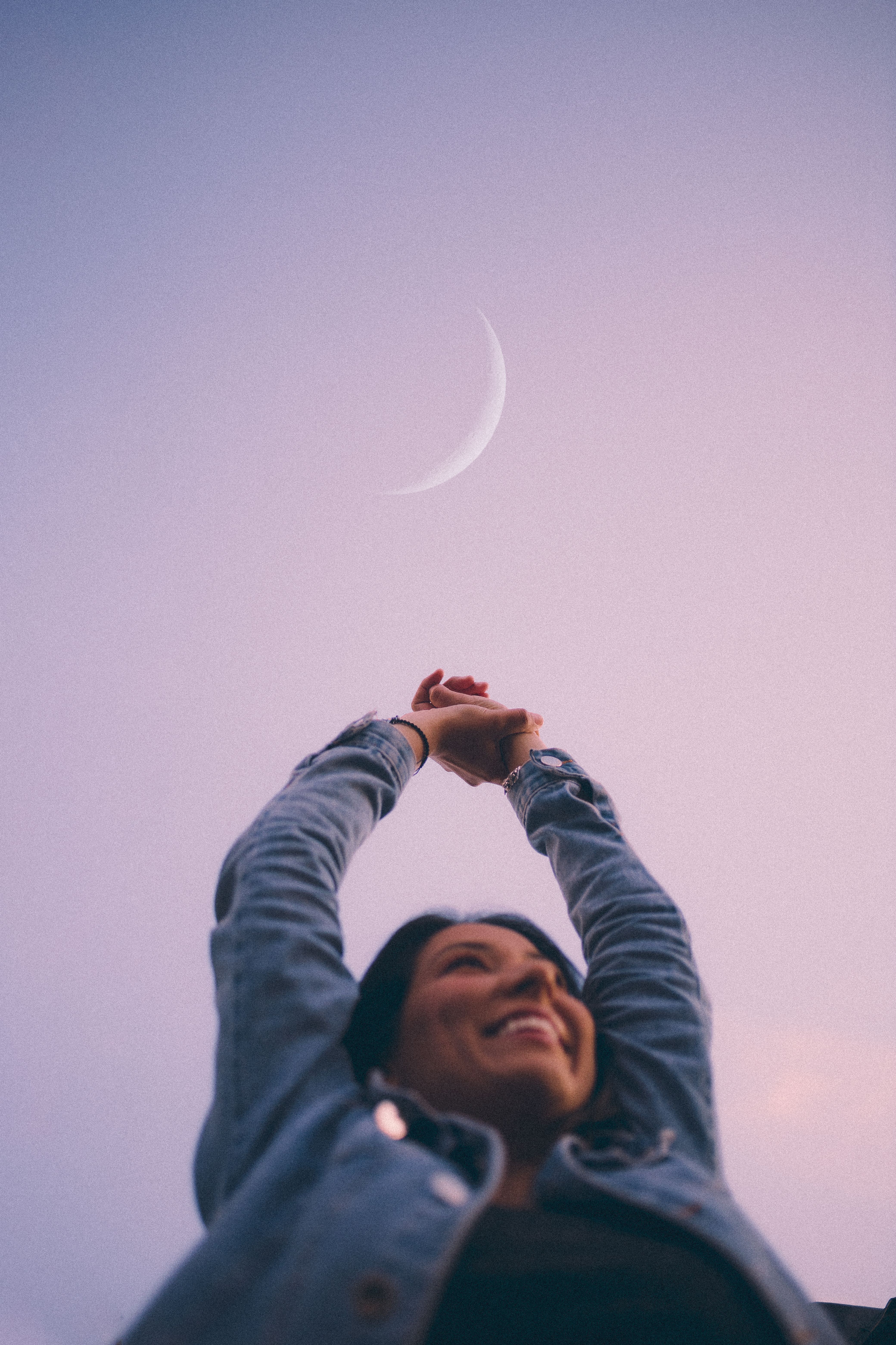 Smiling Woman under Crescent Moon · Free Stock Photo