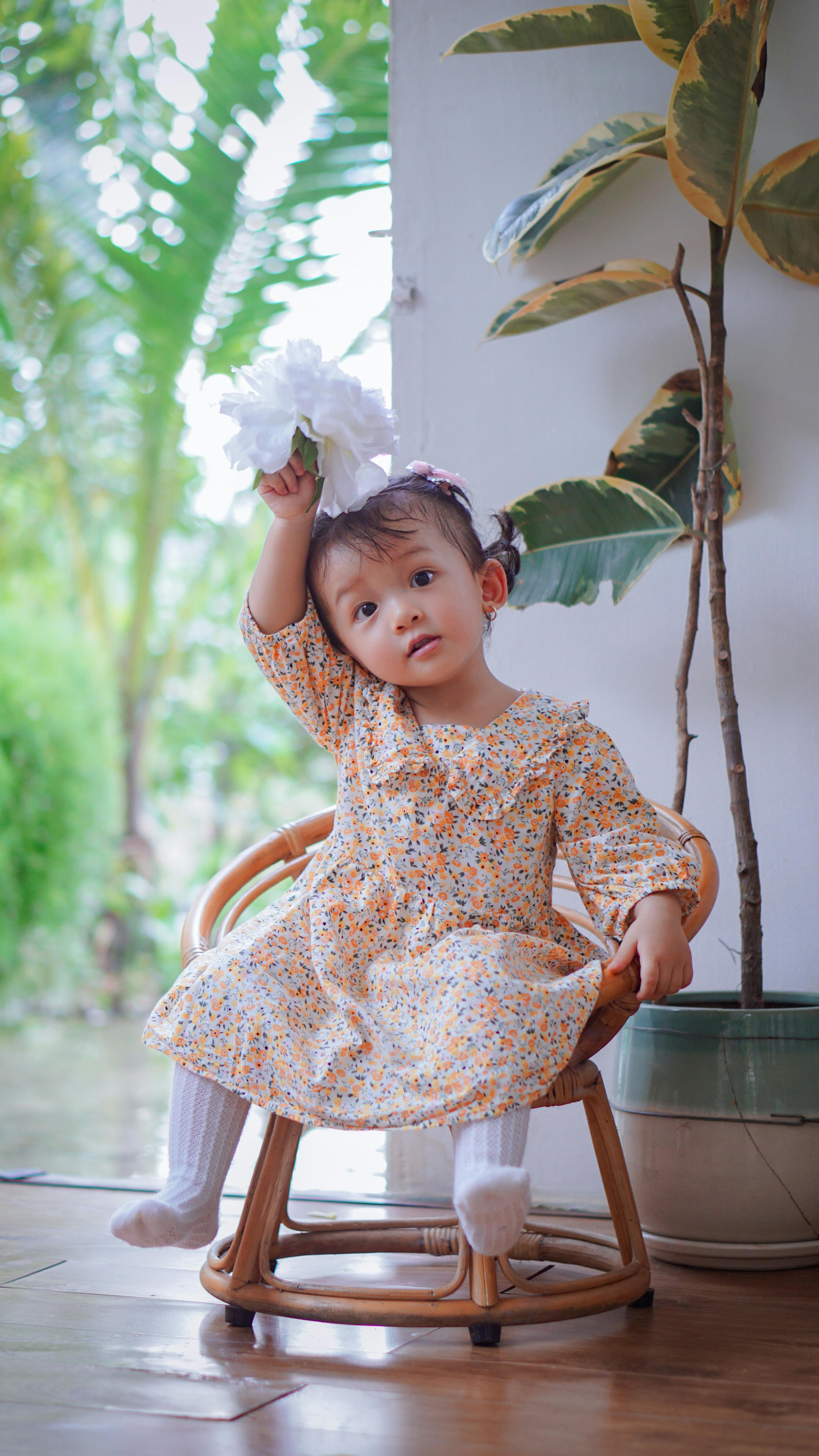 Girl Touching Bush · Free Stock Photo