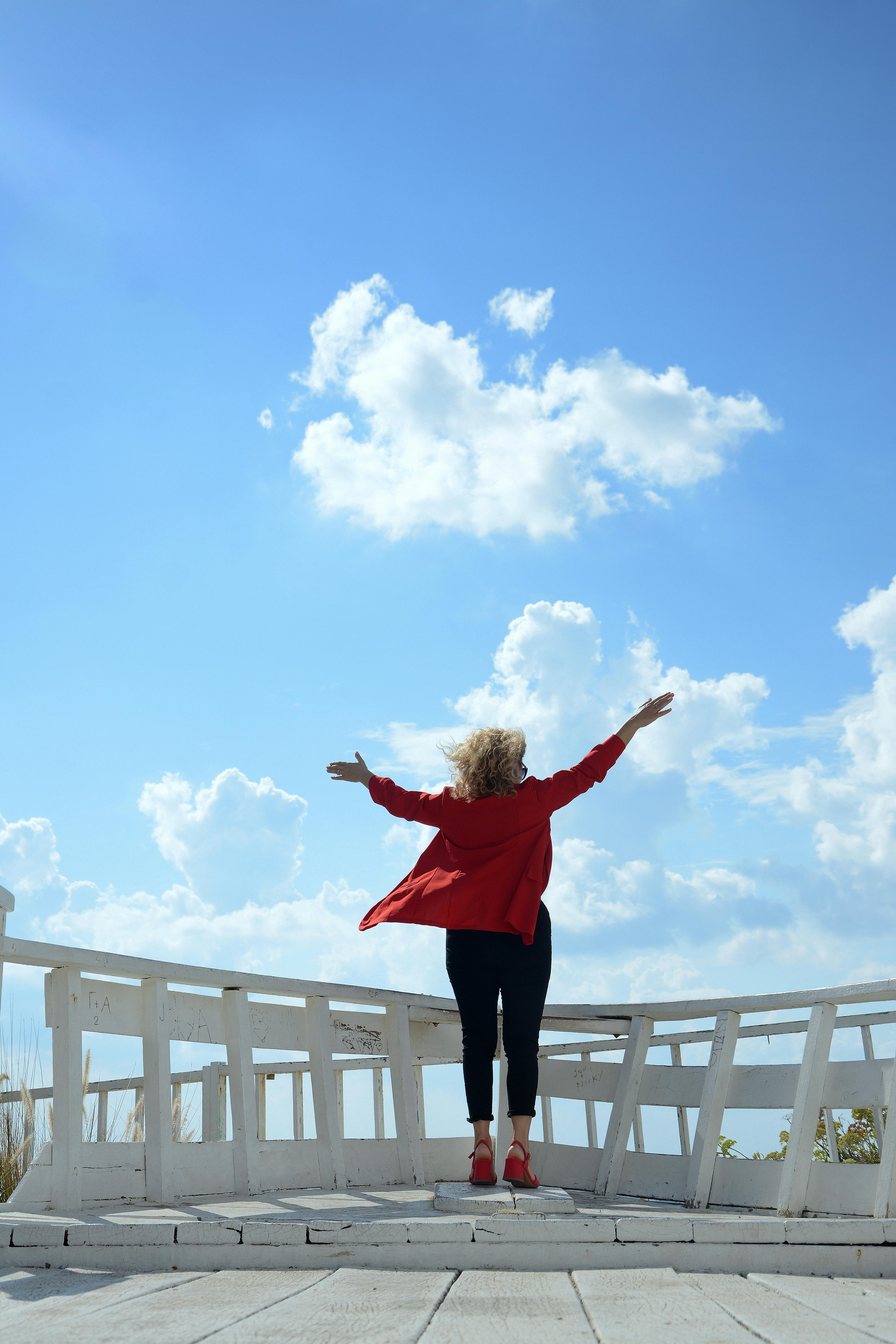 Back View of Woman Standing and Posing with Arms Raised · Free Stock Photo