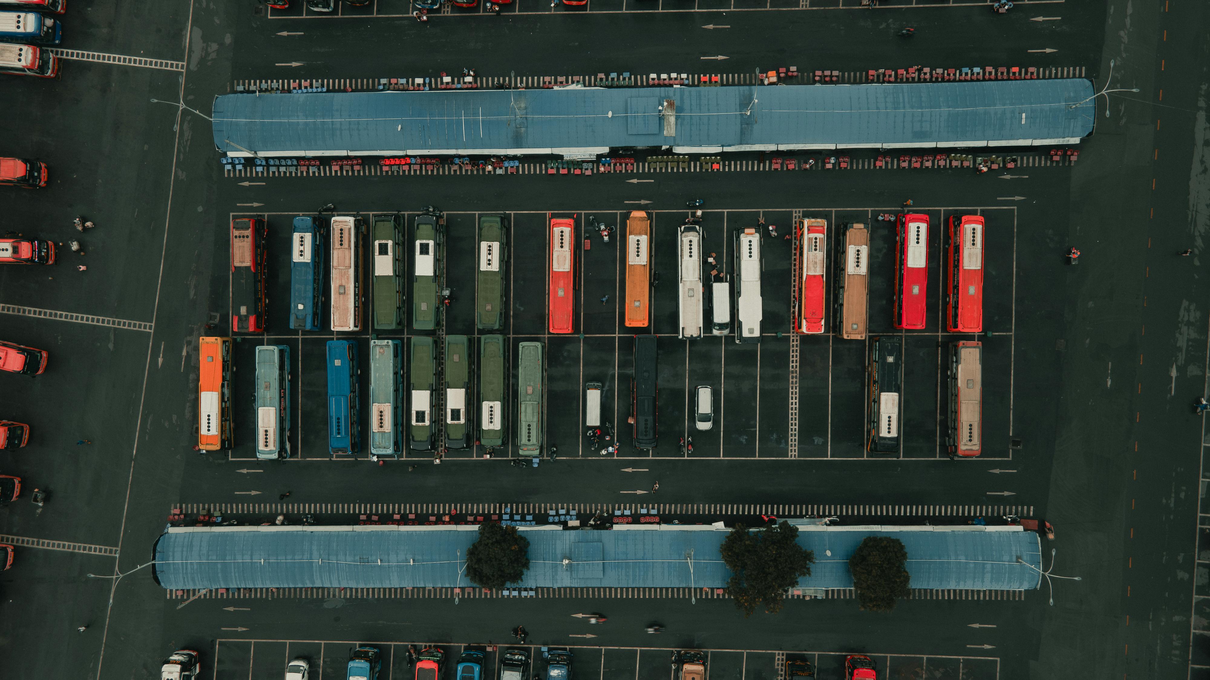 Aerial Photography of a Bus Station with Parked Buses · Free Stock Photo
