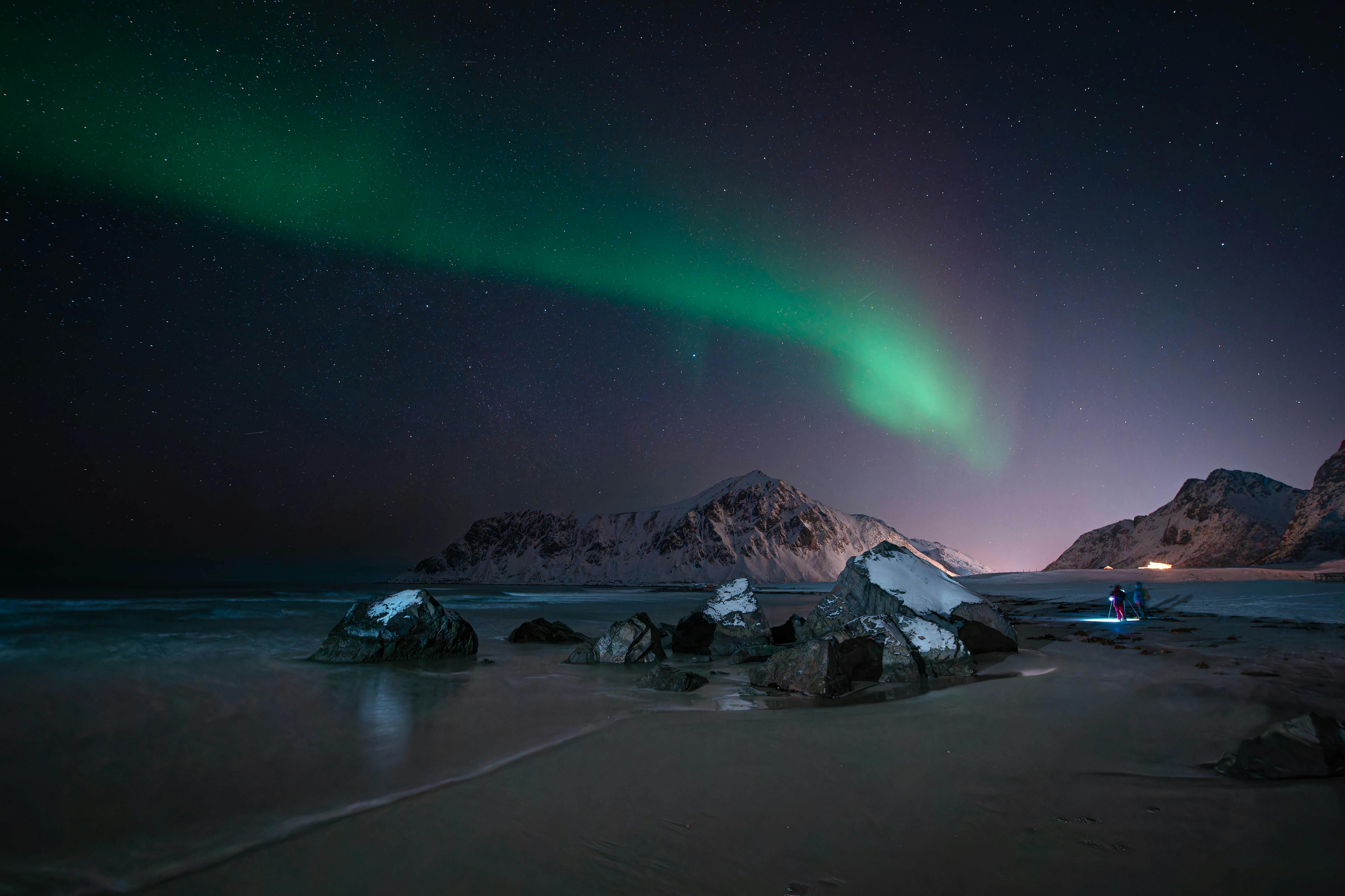 Aurora Borealis over Sea Shore at Night · Free Stock Photo