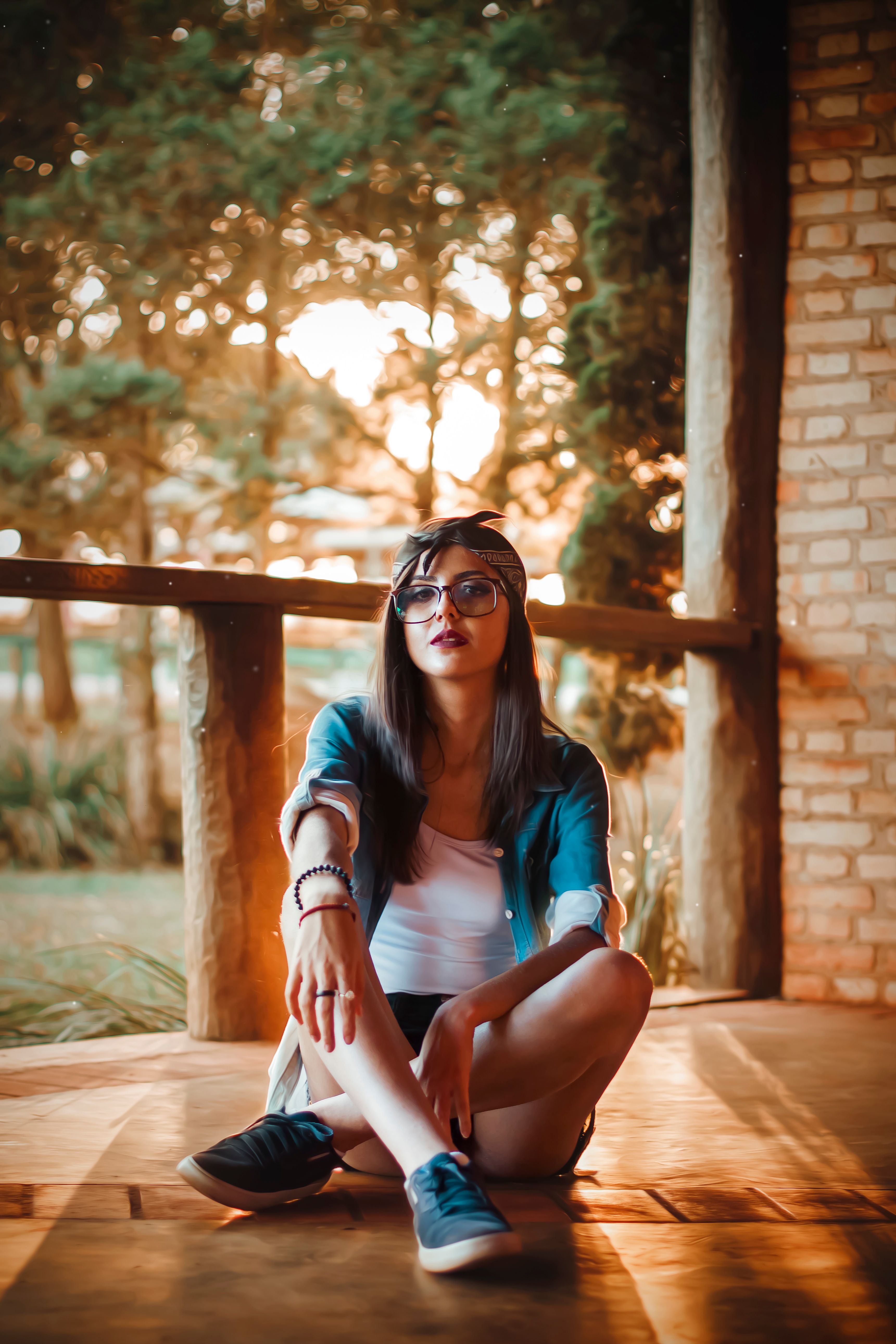 Photo of Woman Crouching Near Shutter Door · Free Stock Photo