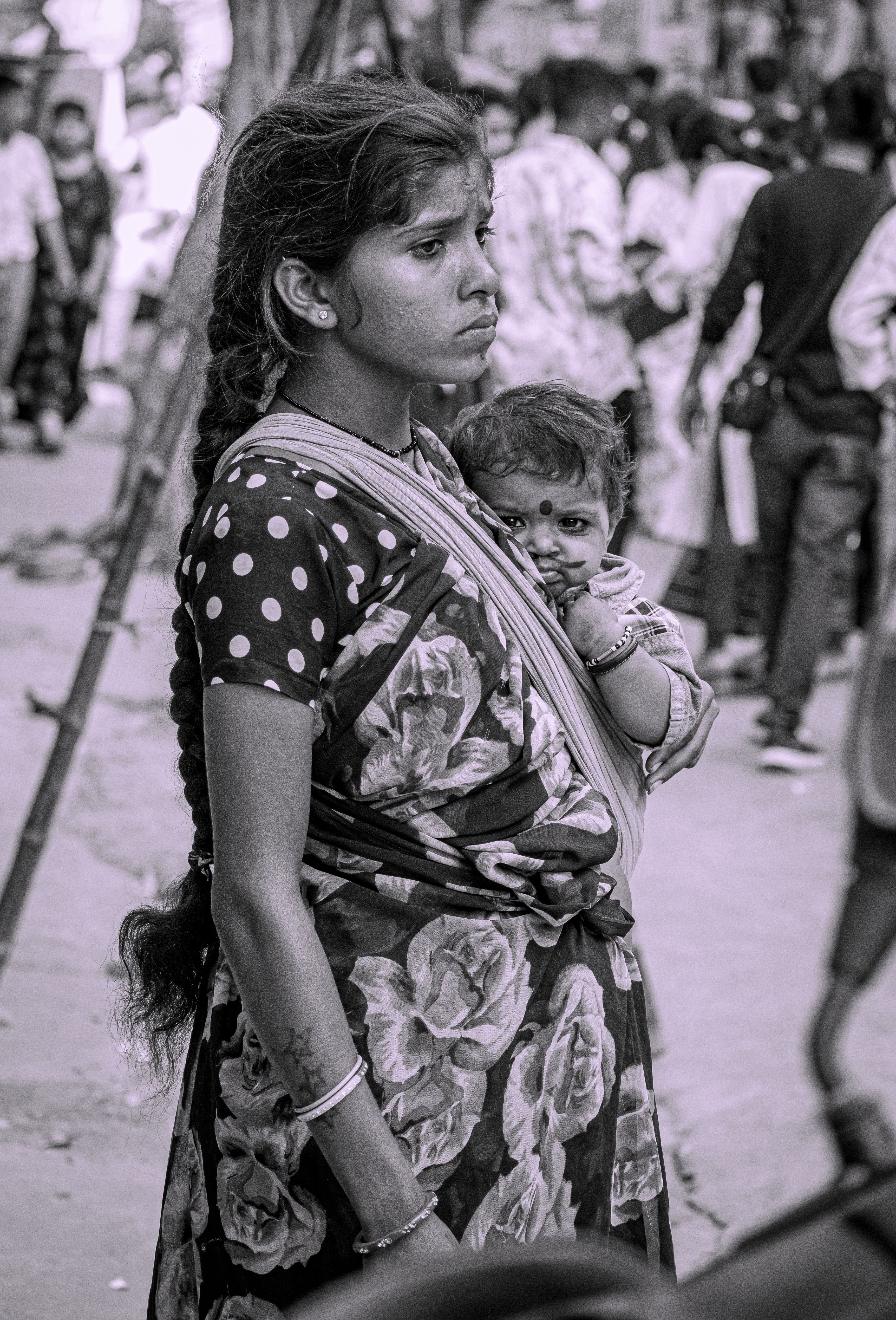Mother in Traditional Clothing Holding Baby · Free Stock Photo