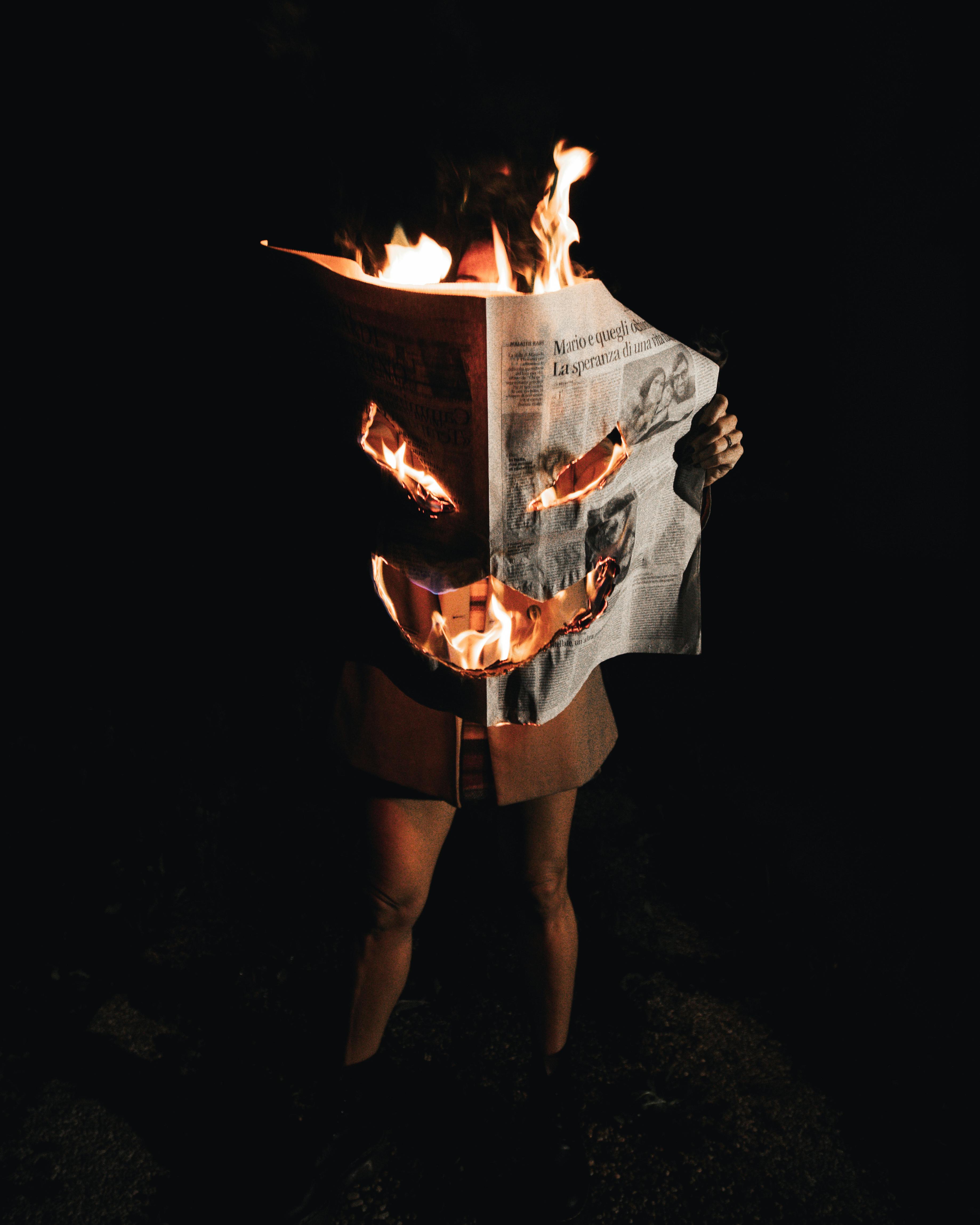 Spooky Newspaper in Flames · Free Stock Photo