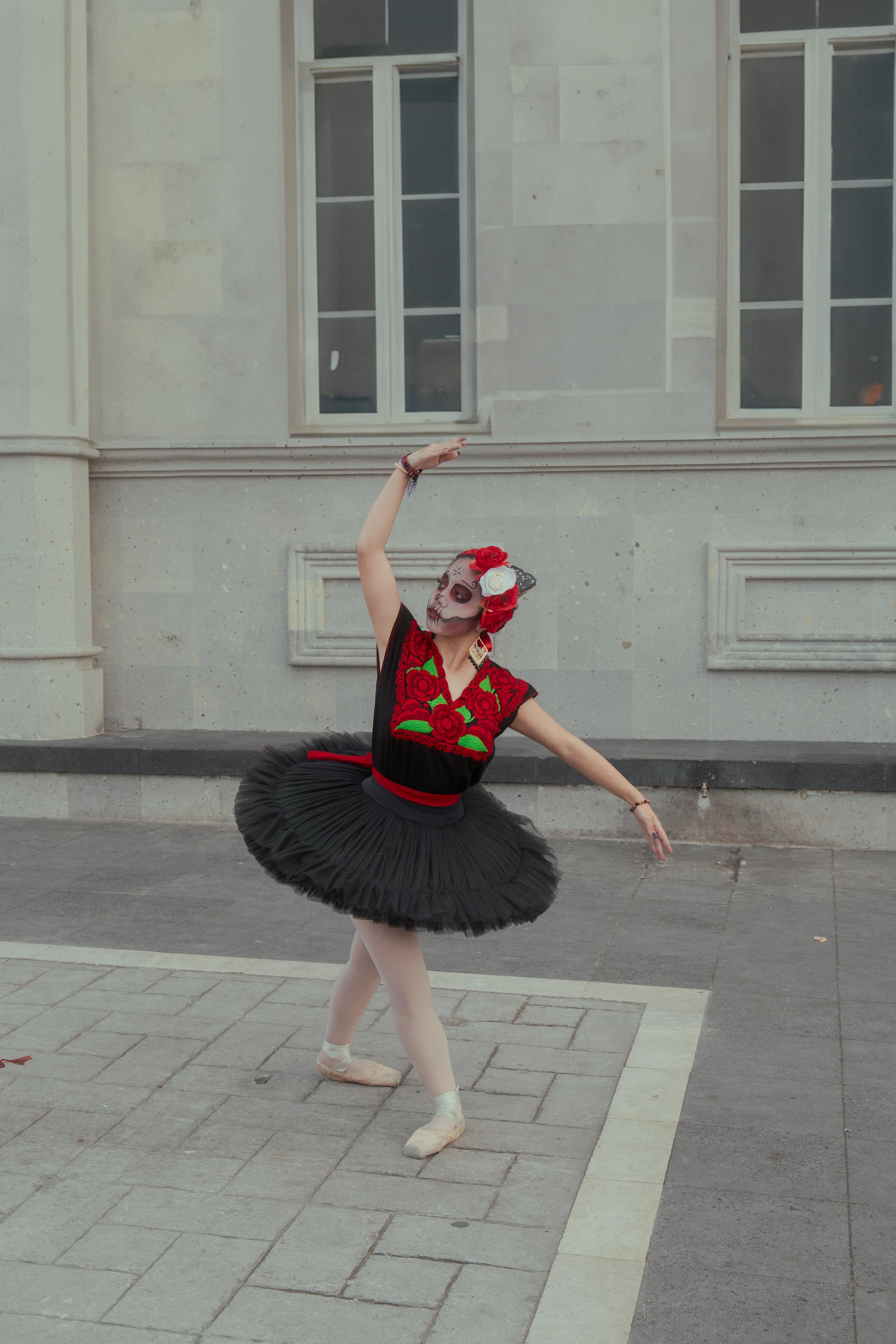 Dancer with Painted Face Dancing and Posing · Free Stock Photo