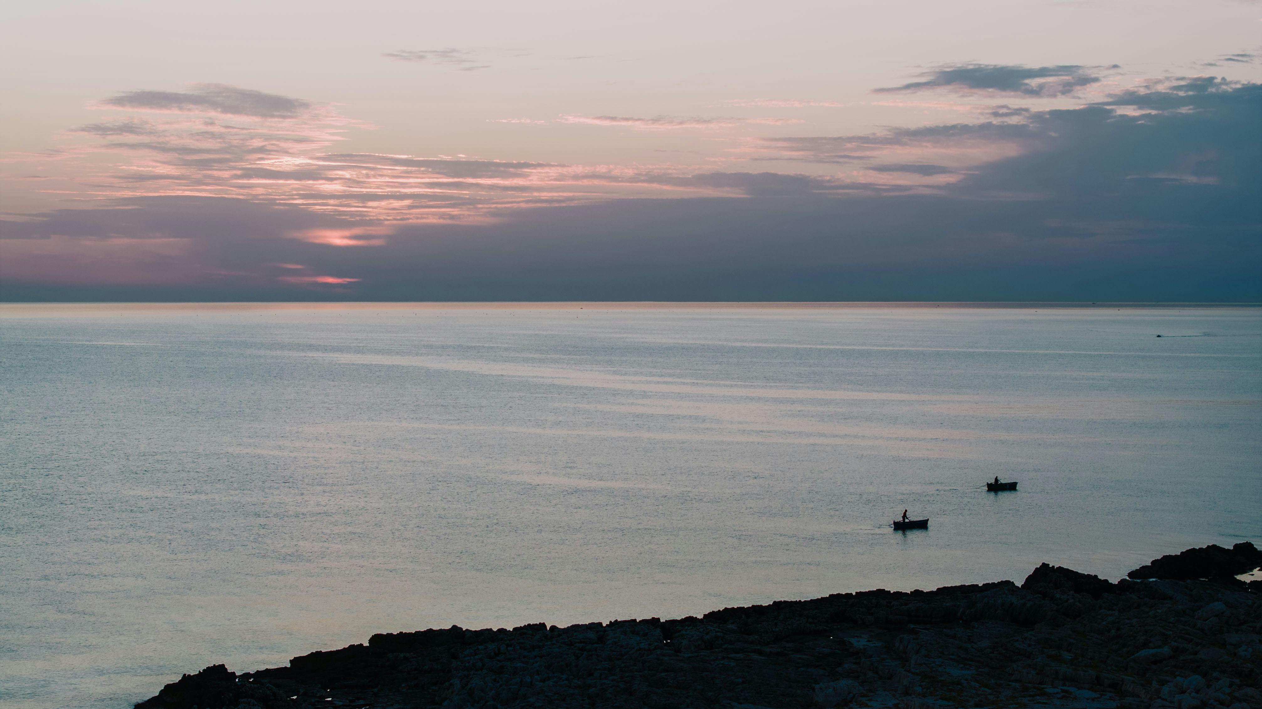 Boats on Calm Seashore · Free Stock Photo