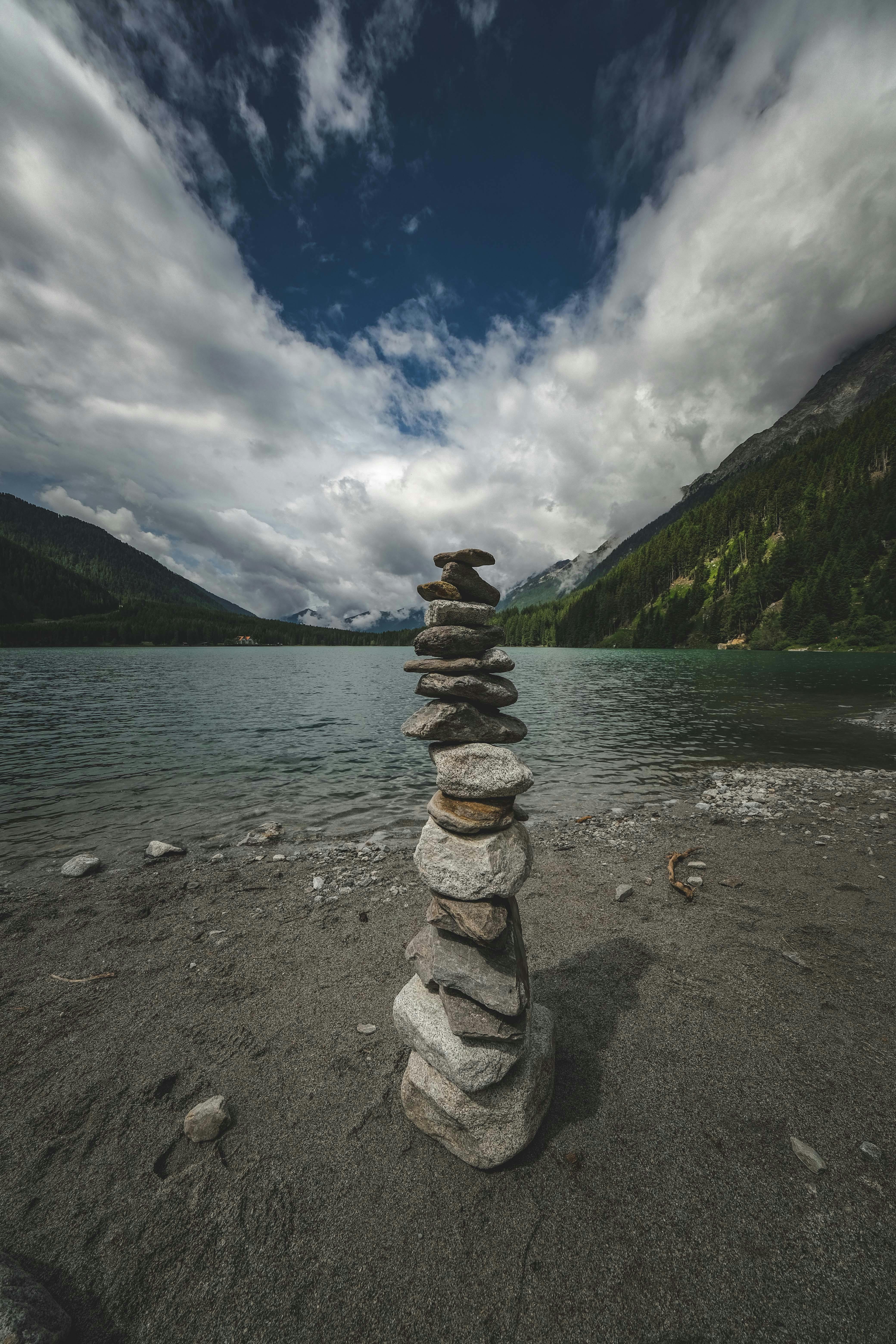 Stones Stacked on Beach on Lakeshore · Free Stock Photo