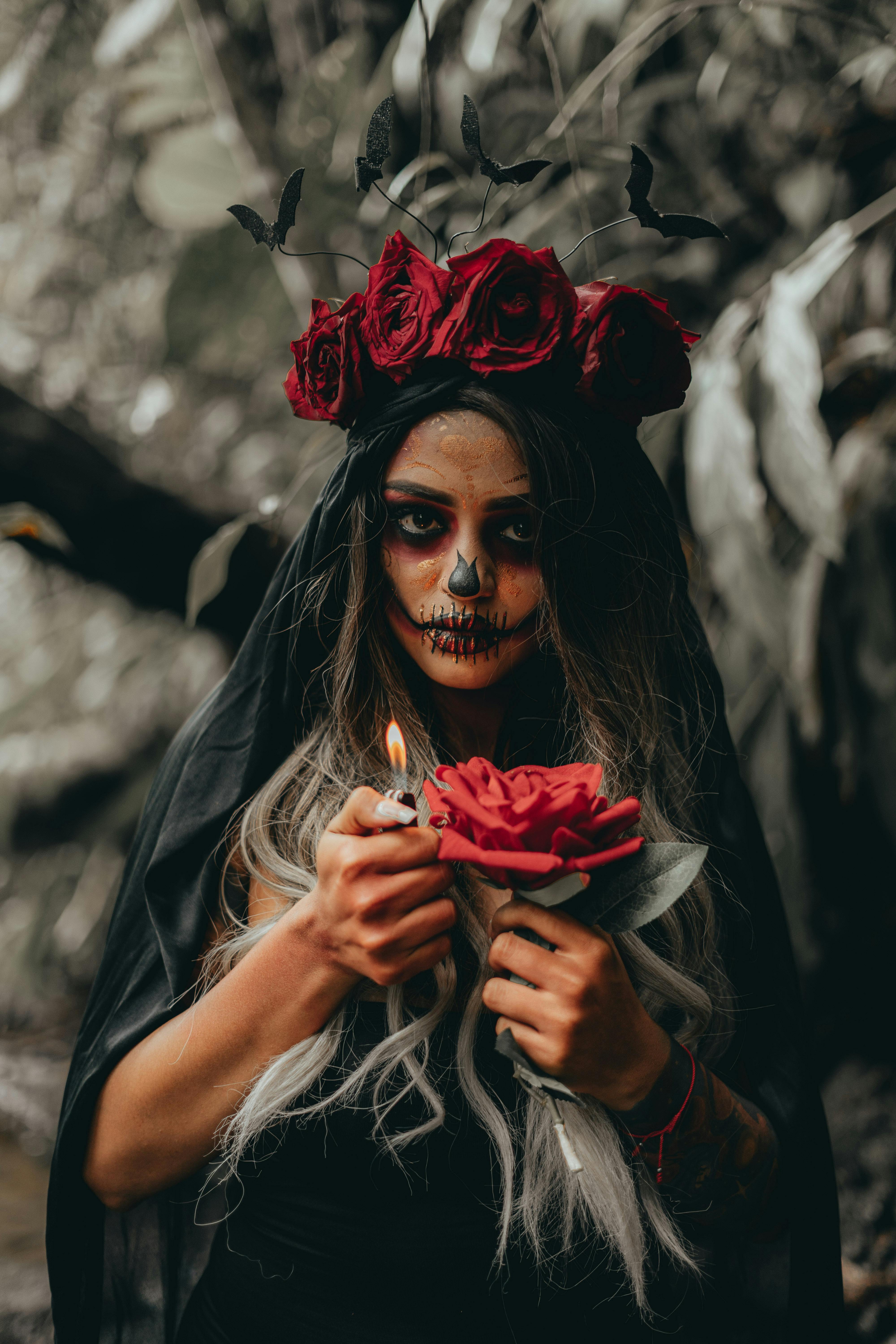 Catrina with Lighter and Red Roses · Free Stock Photo