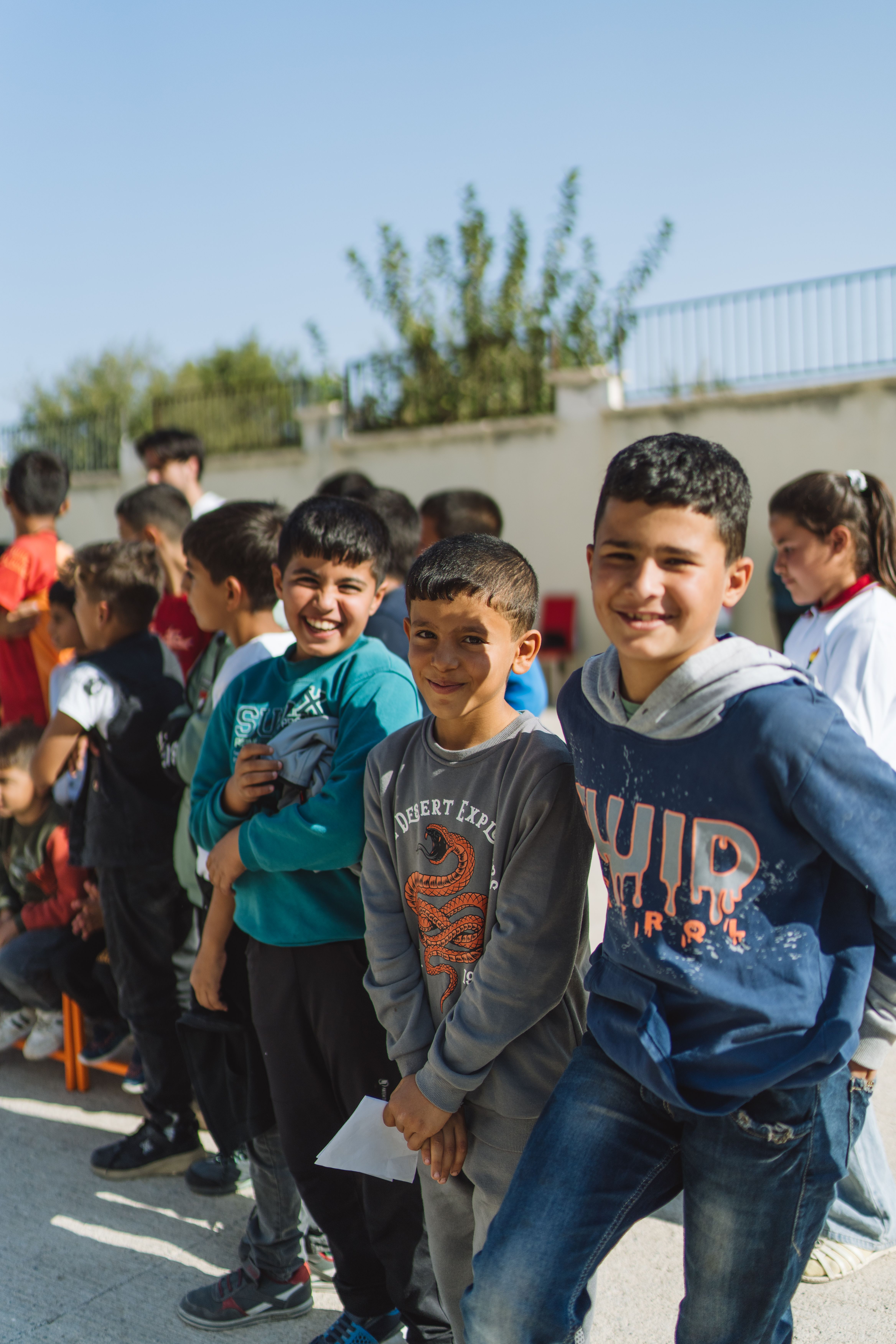 Smiling Boys Standing Together · Free Stock Photo