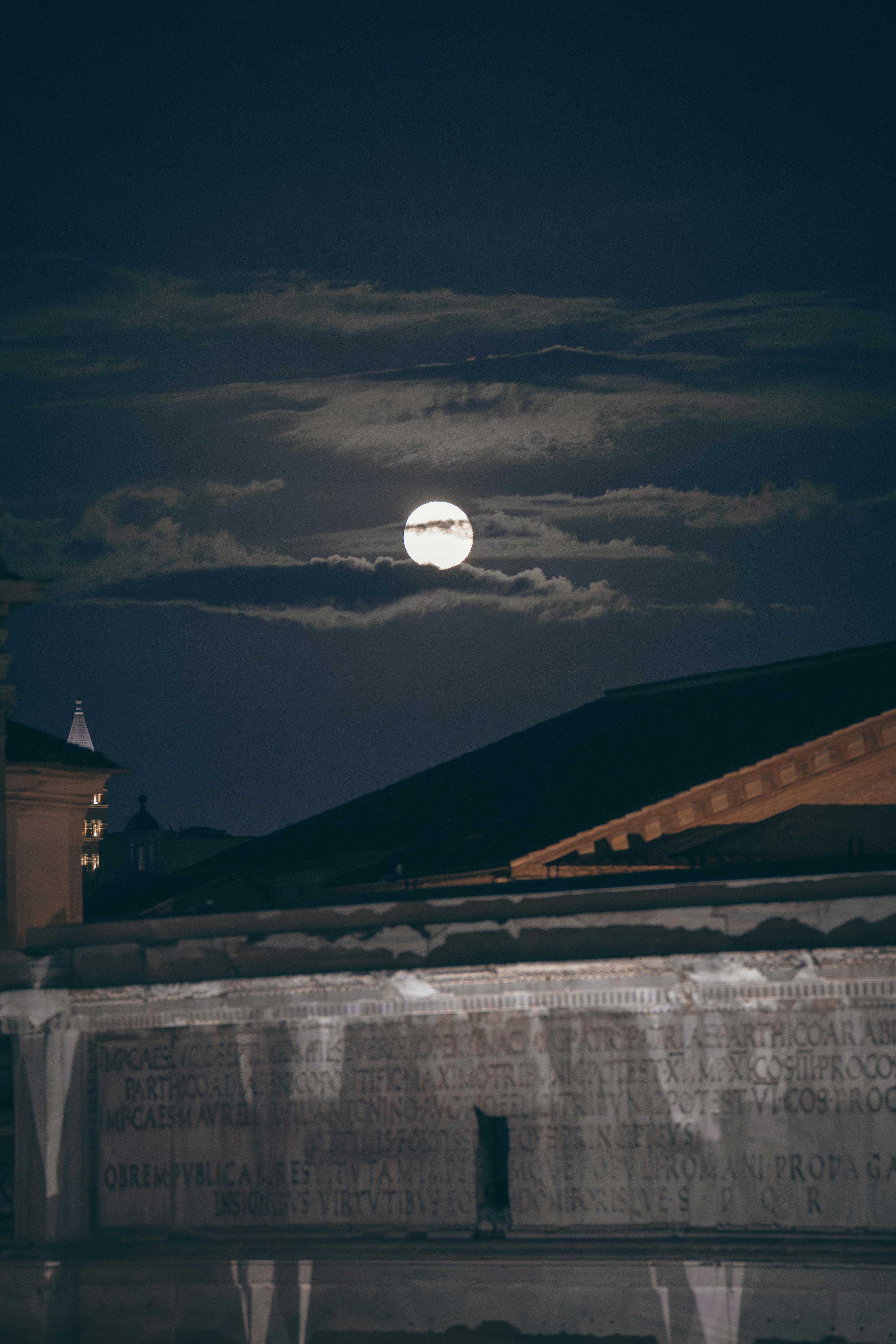 Full Moon Shining through Clouds over Roof Tops in Rome, Italy · Free ...