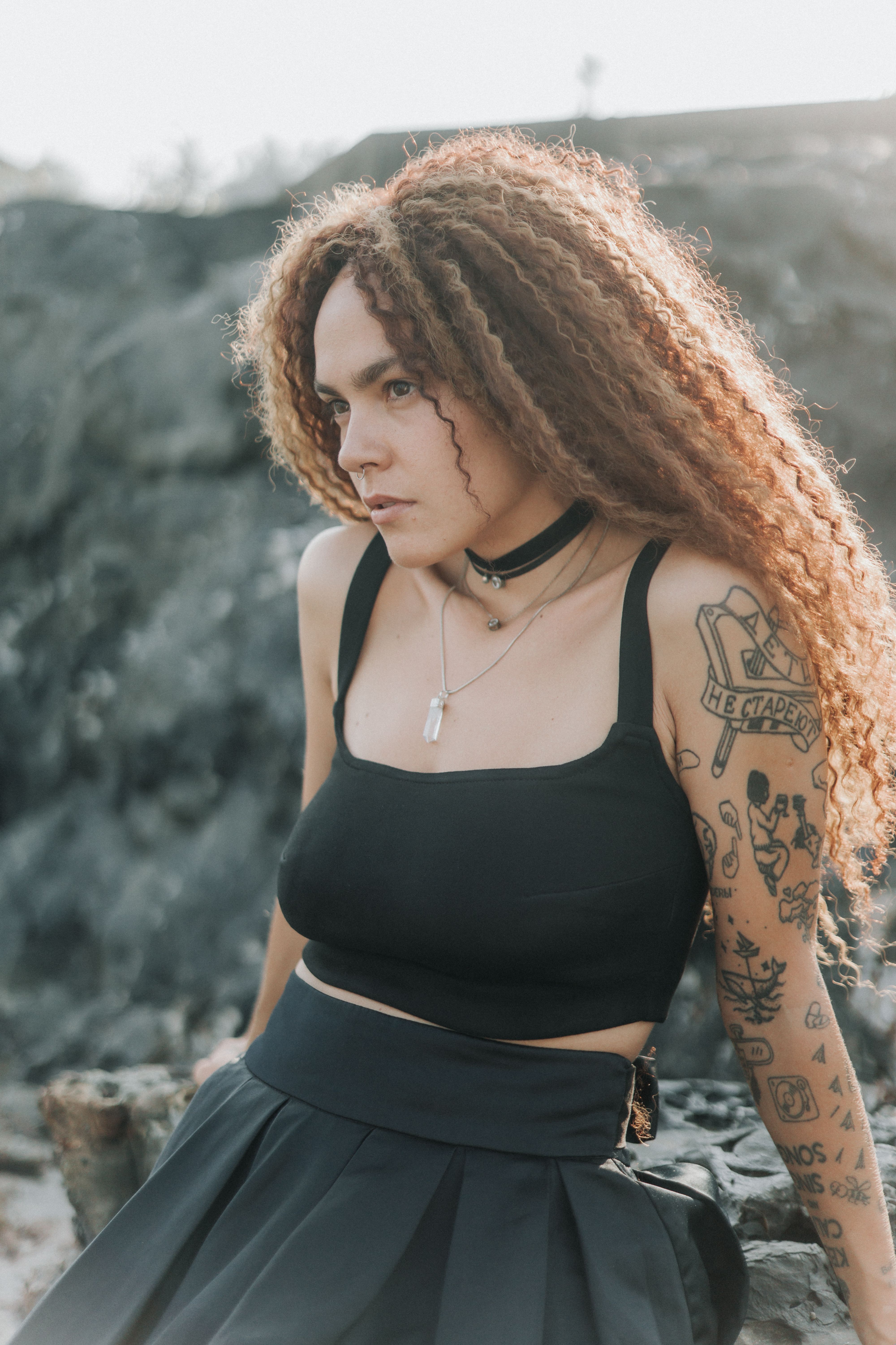 Low Angle Portrait of Woman in Crop Top and a Skirt with Long Slit ...