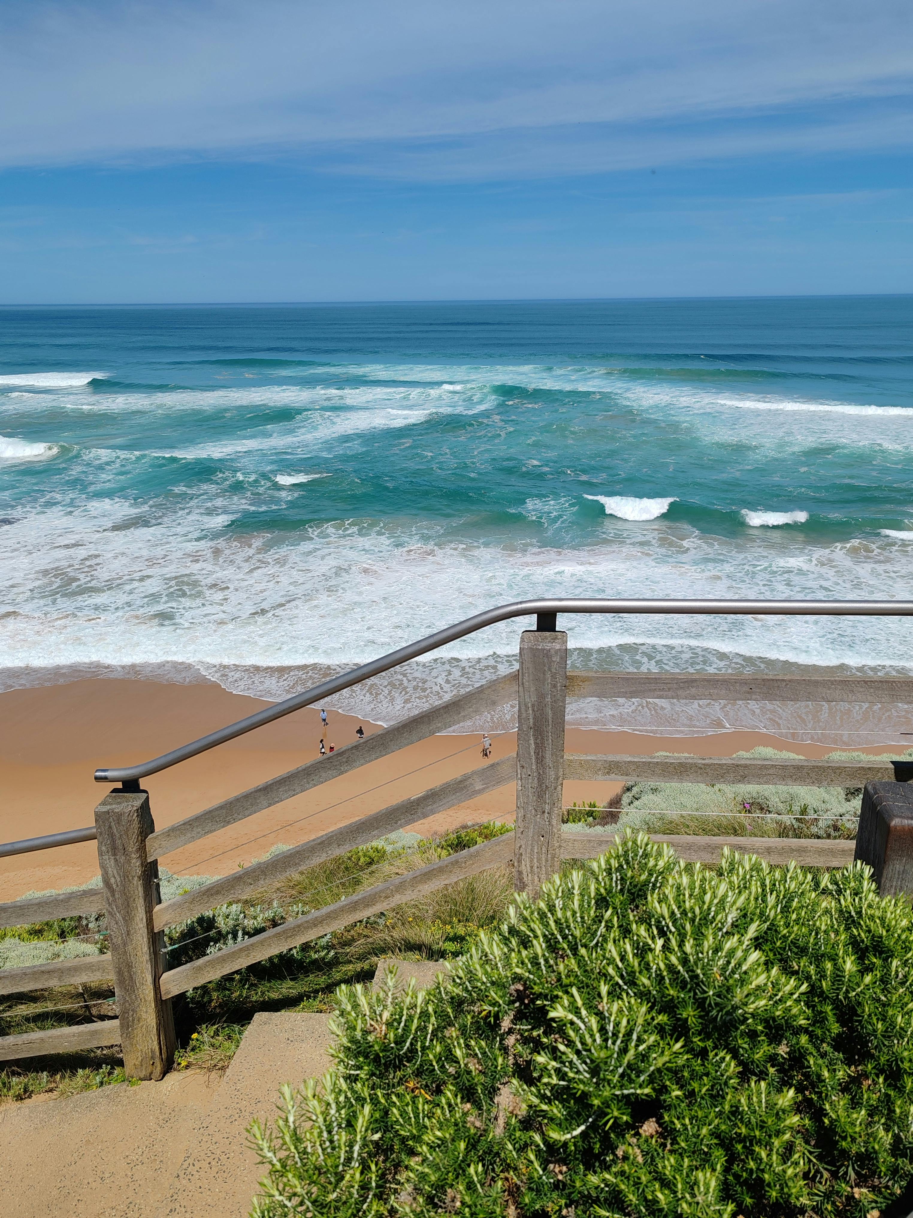 Stairs with Handrail Leading to a Sand Beach · Free Stock Photo