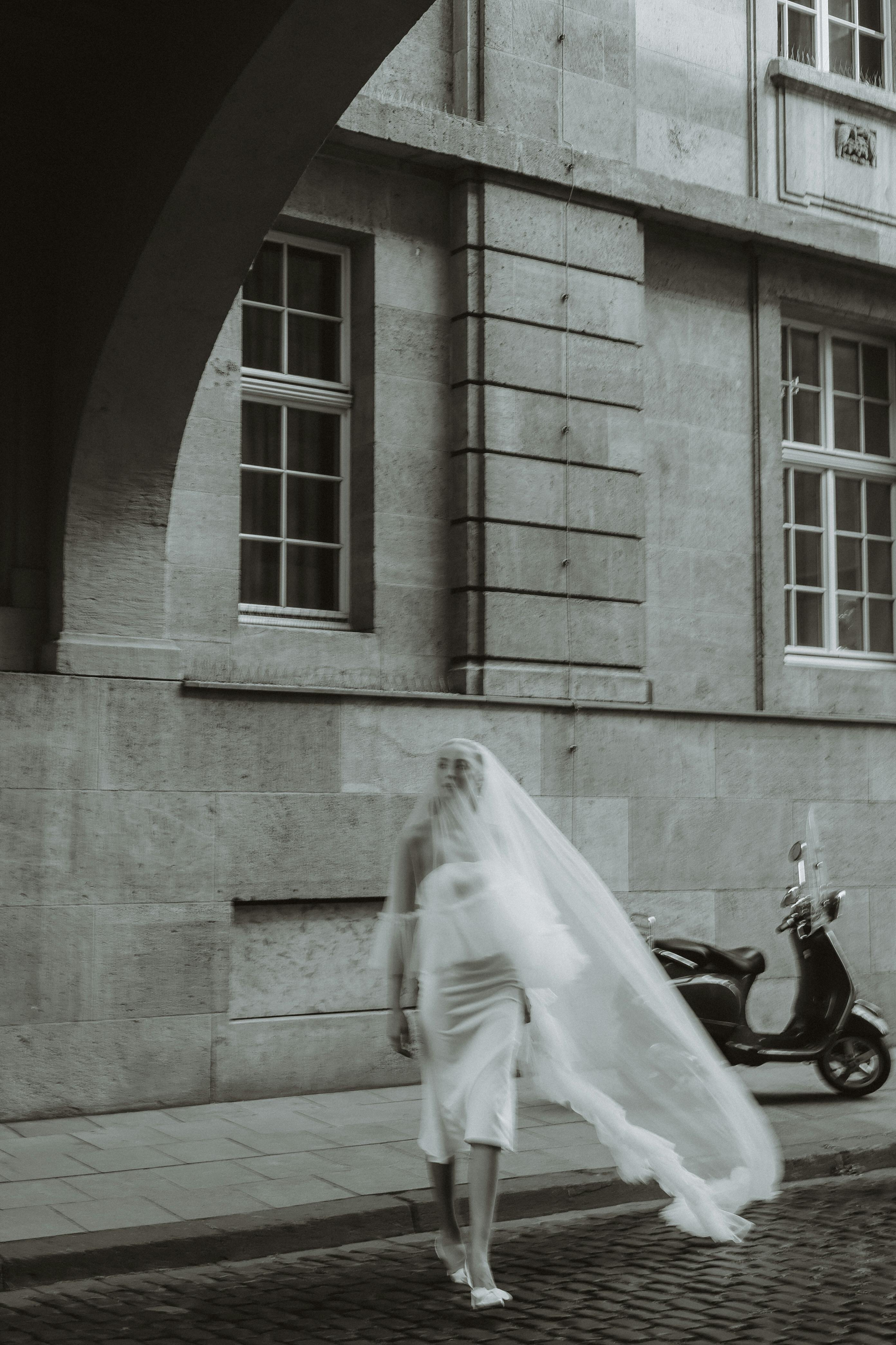 Bride Walking on a Cobblestone Street · Free Stock Photo