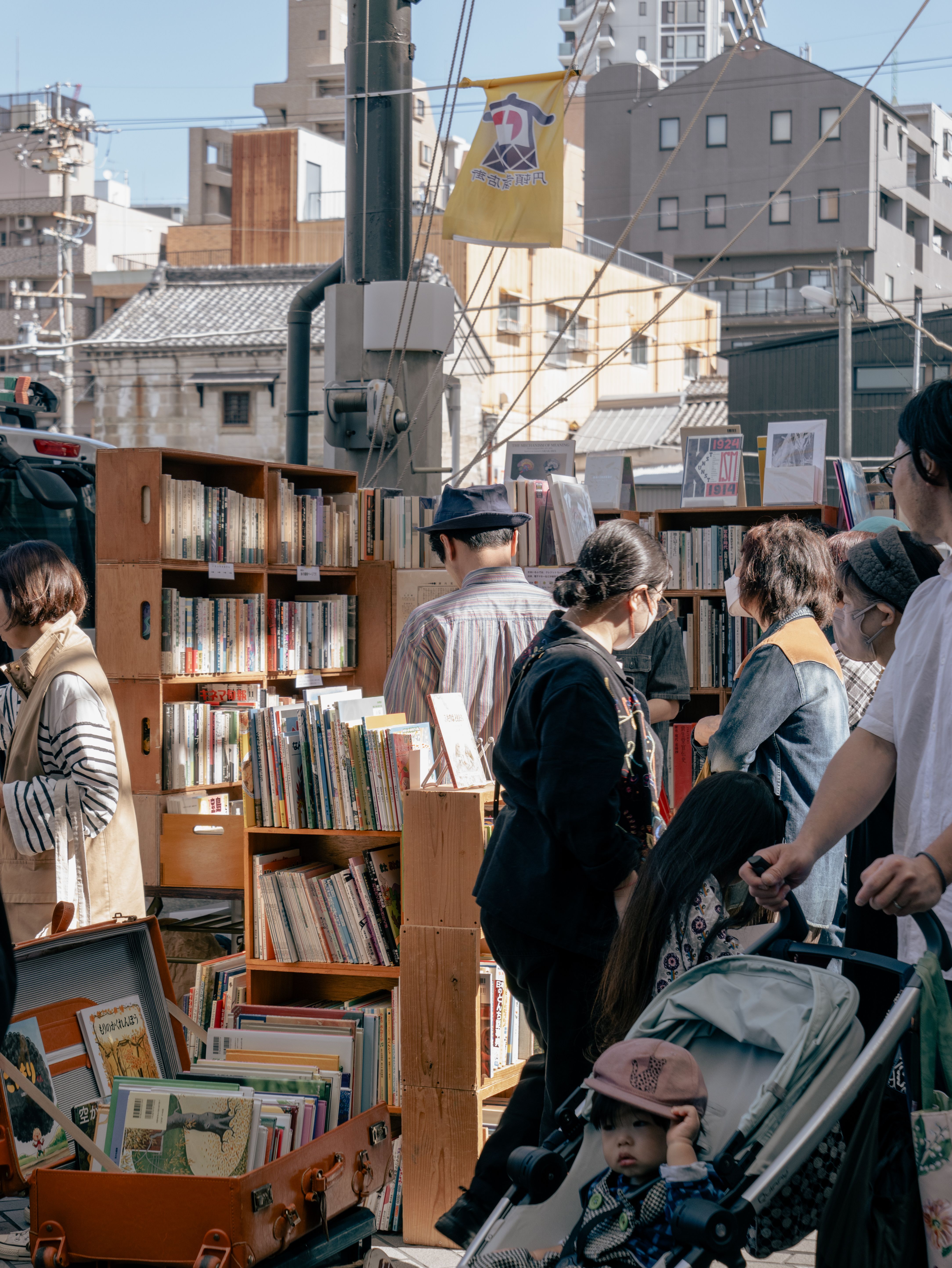 People Walking around an Old Book Market in City · Free Stock Photo