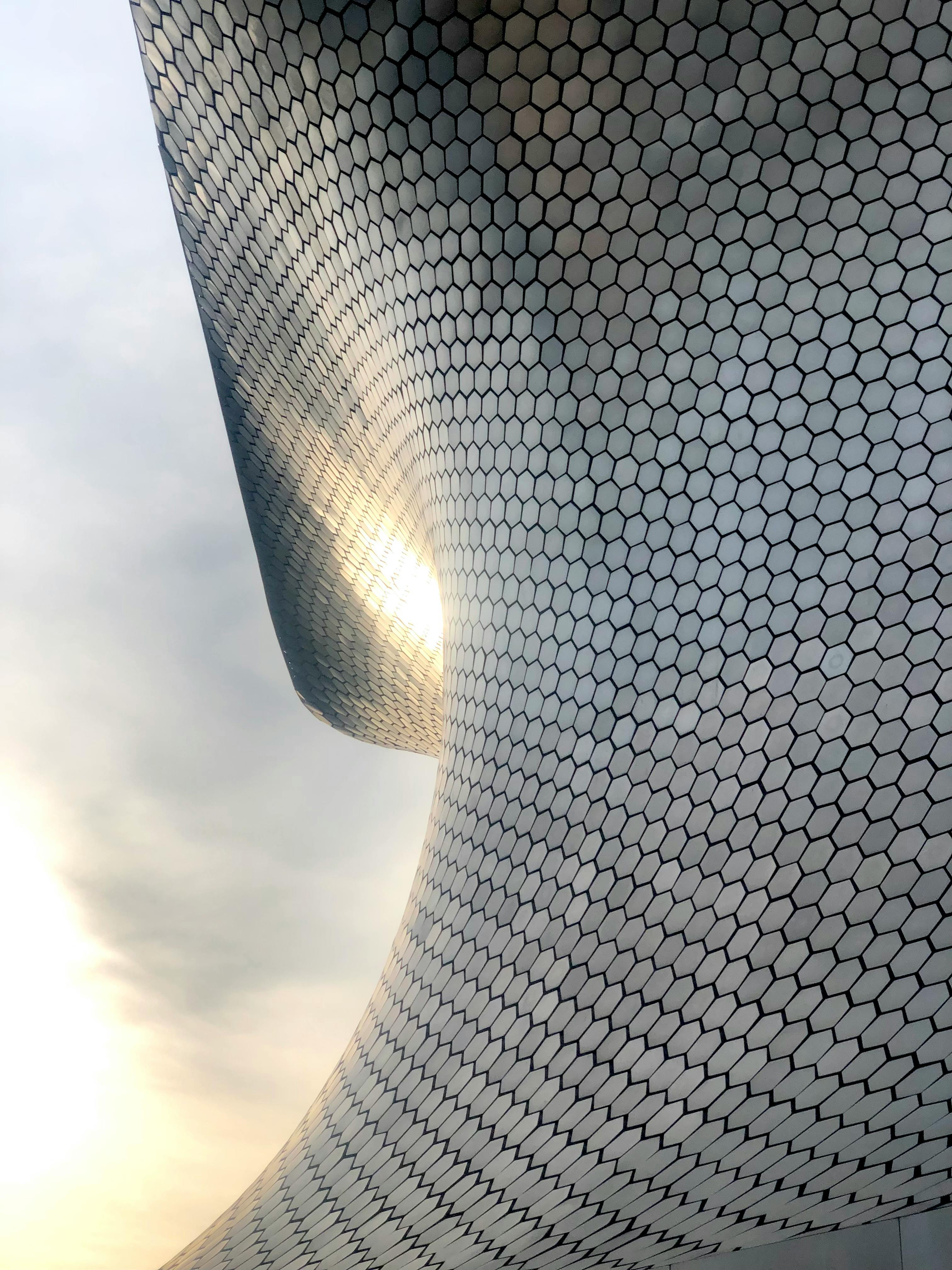 Sunset Sunlight on Futuristic Building Wall · Free Stock Photo