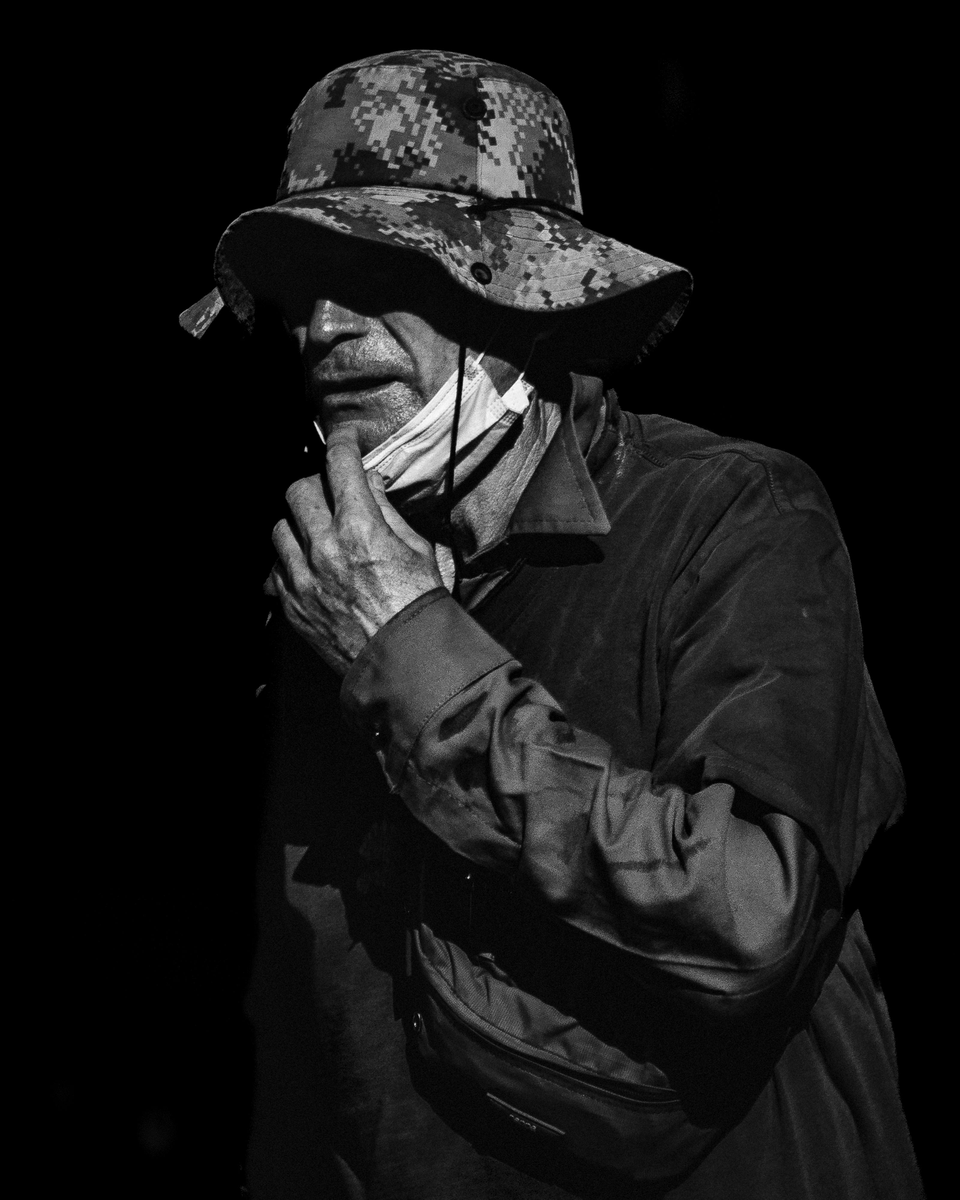 Dark, Black and White Photo of a Man Wearing a Hat · Free Stock Photo