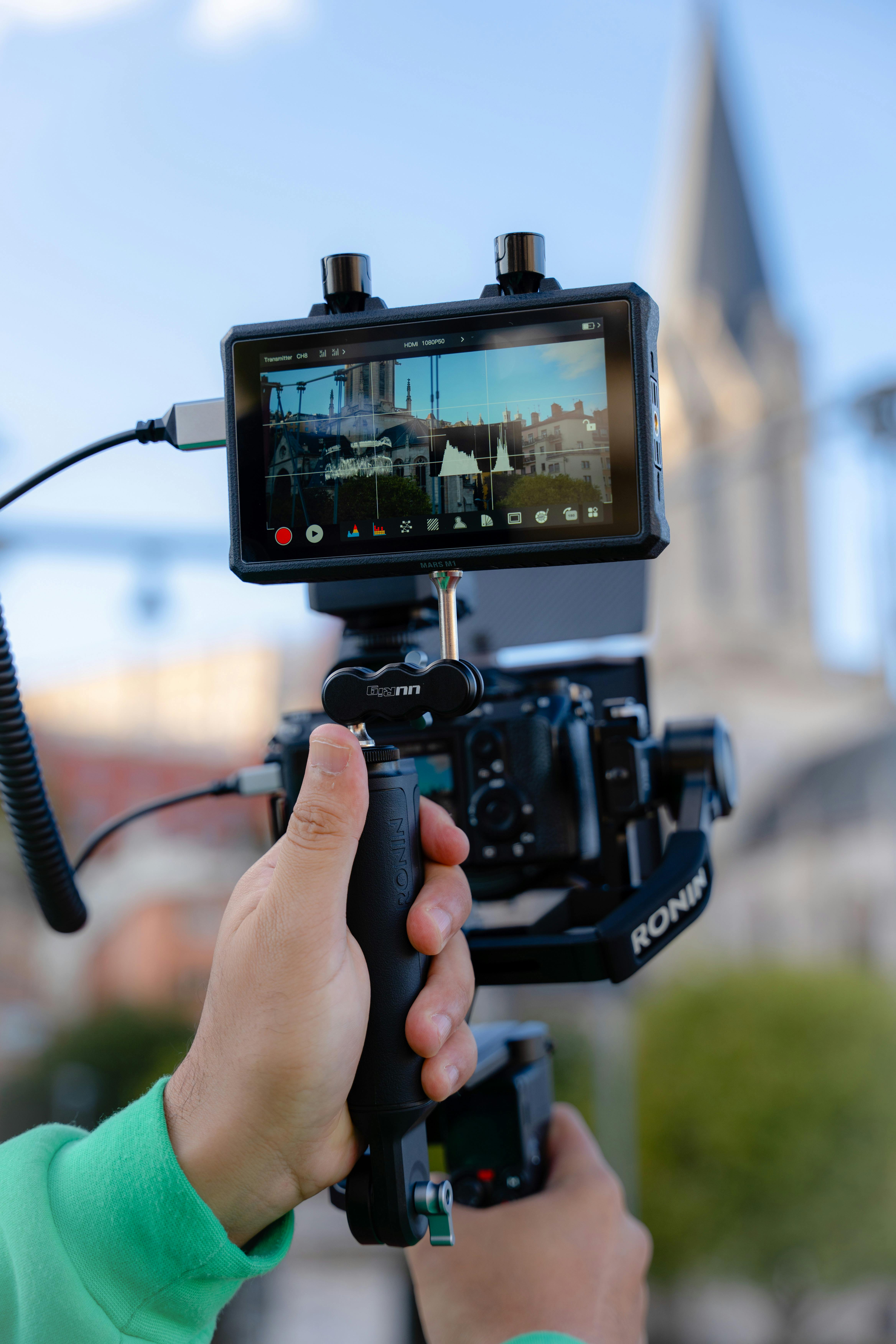 Man Filming a Church with a Professional Video Camera in a Rig · Free ...