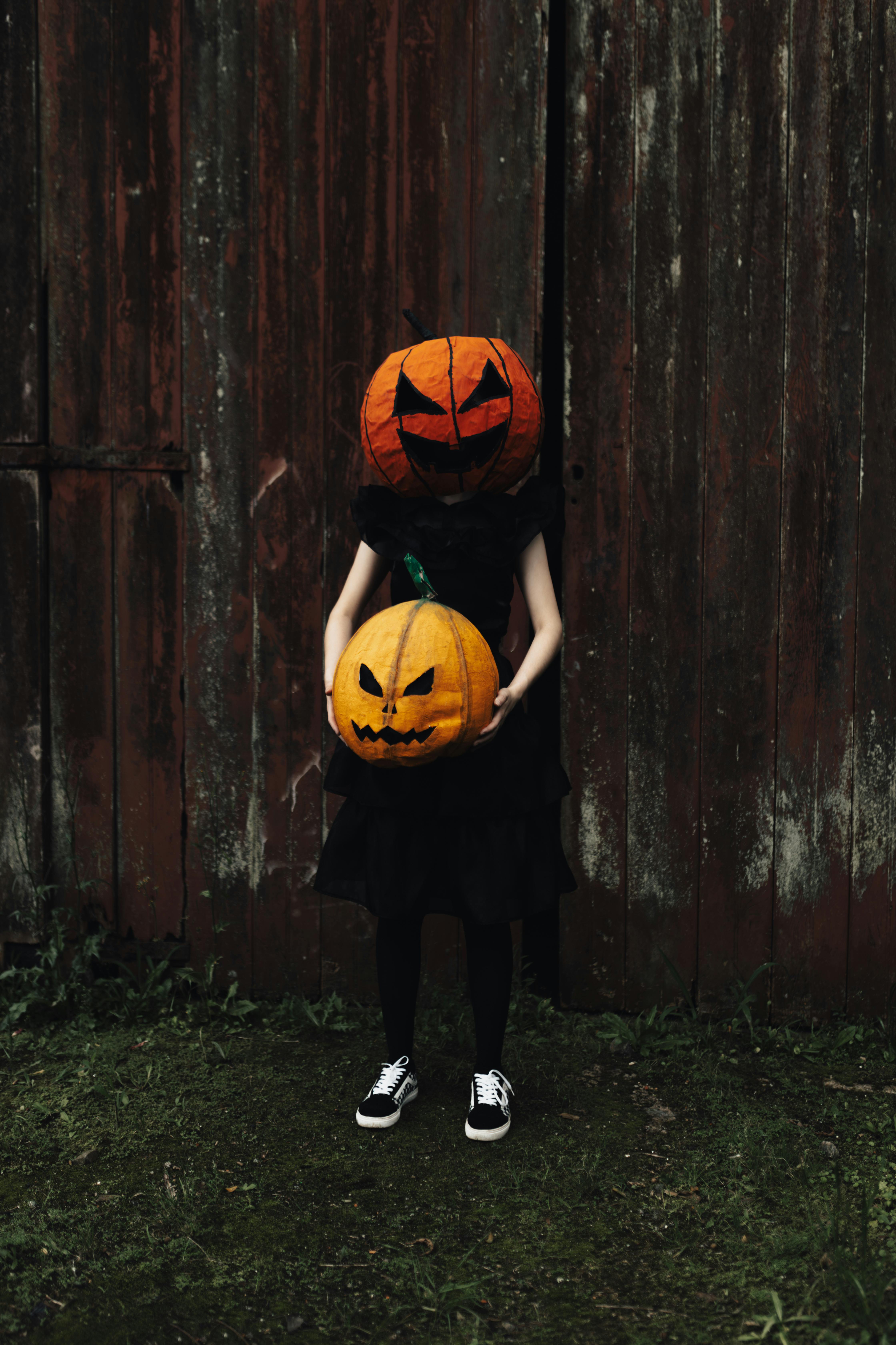 Woman With Face Paint With Pumpkin · Free Stock Photo