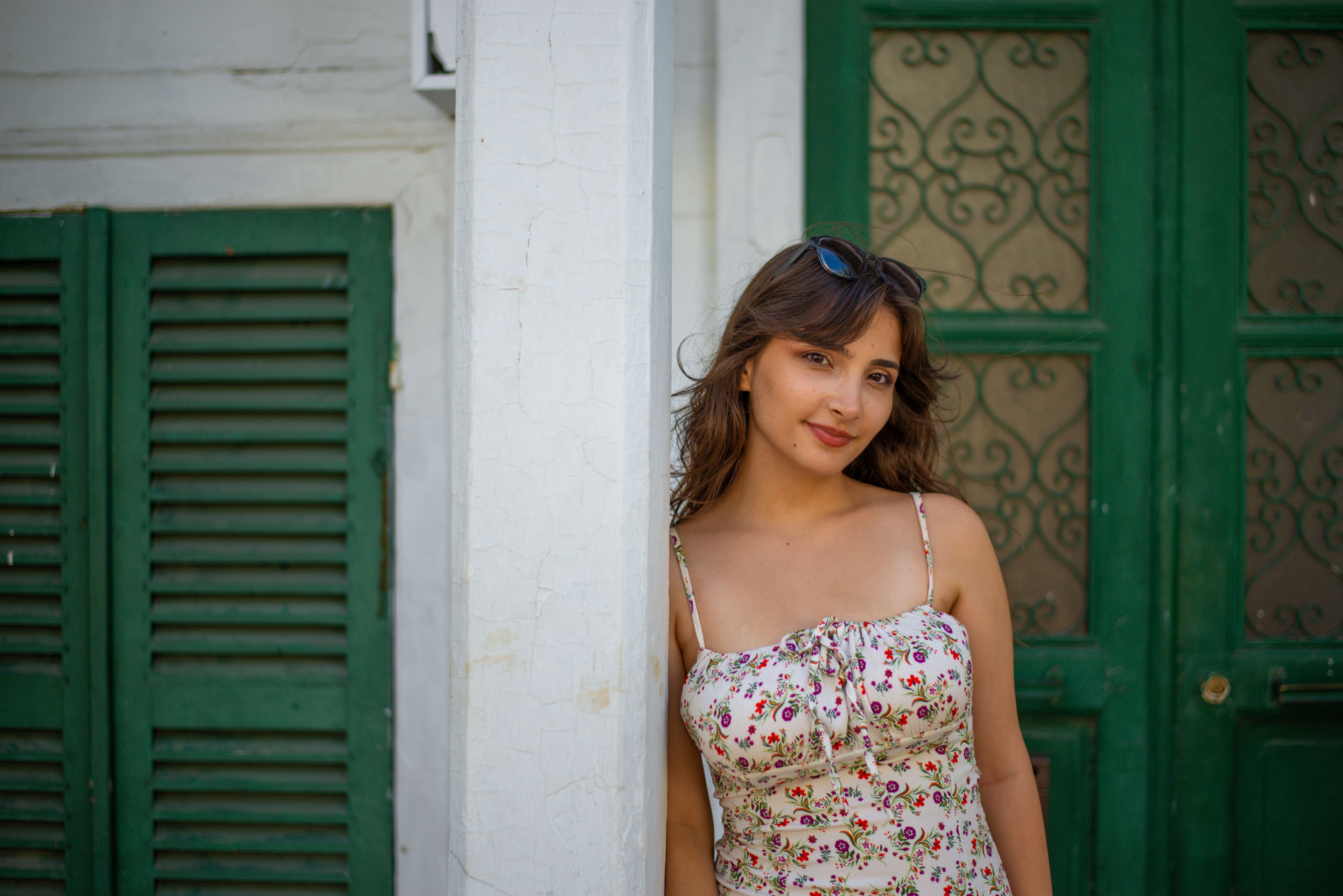 Portrait of Woman in Sundress Standing by Wall · Free Stock Photo