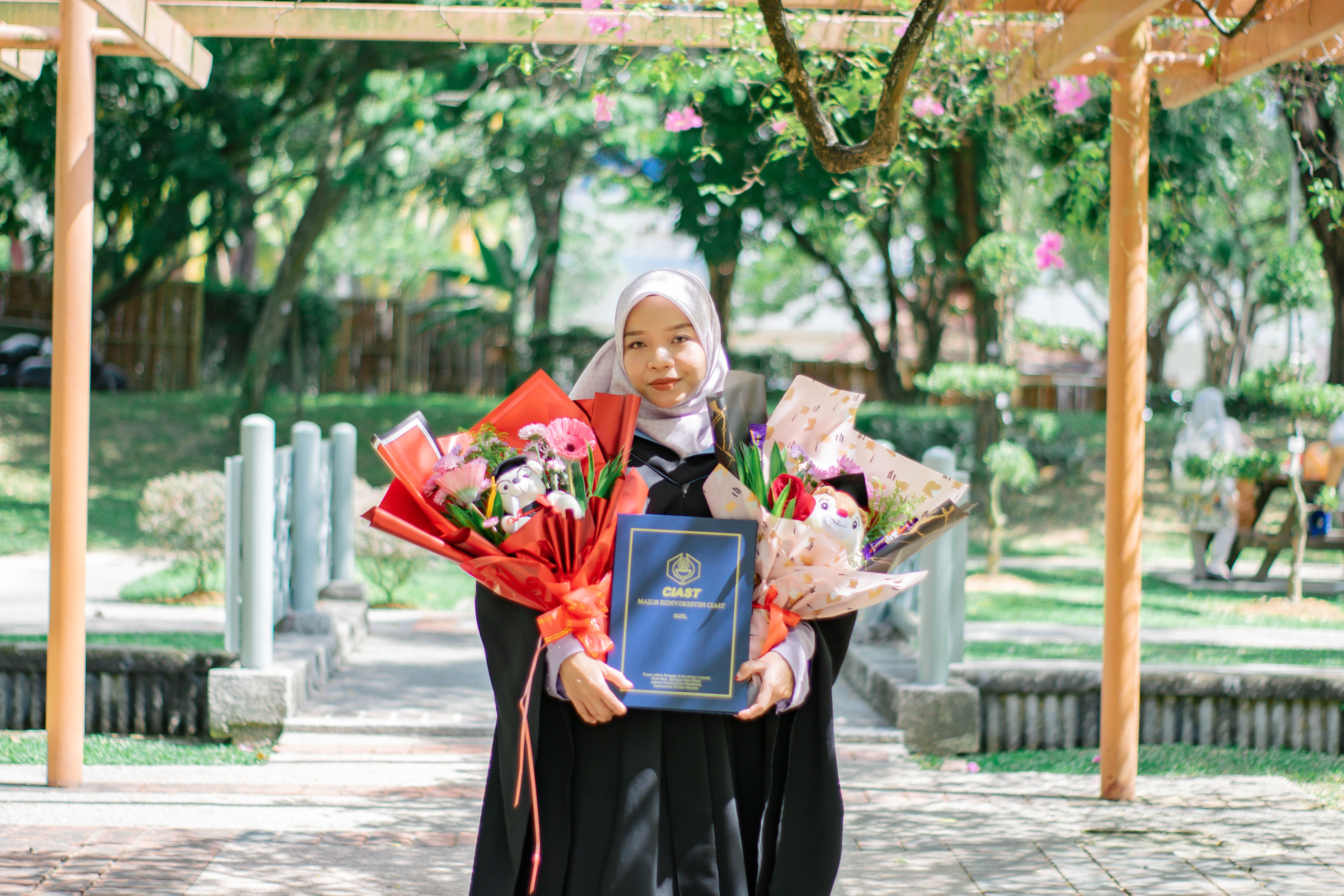 Graduate Woman in Hijab in Park · Free Stock Photo