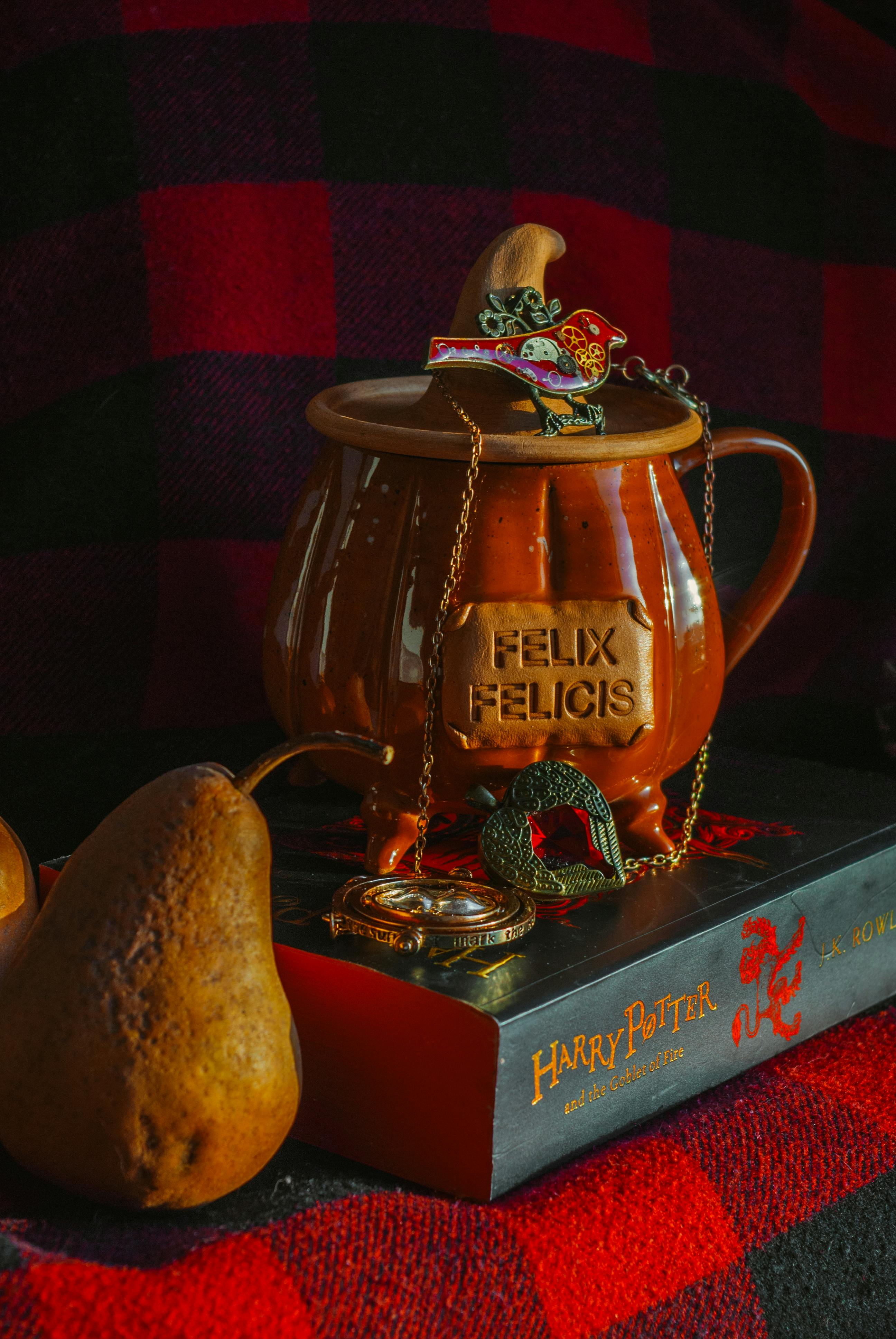 Pot with Elixir on Harry Potter Book · Free Stock Photo