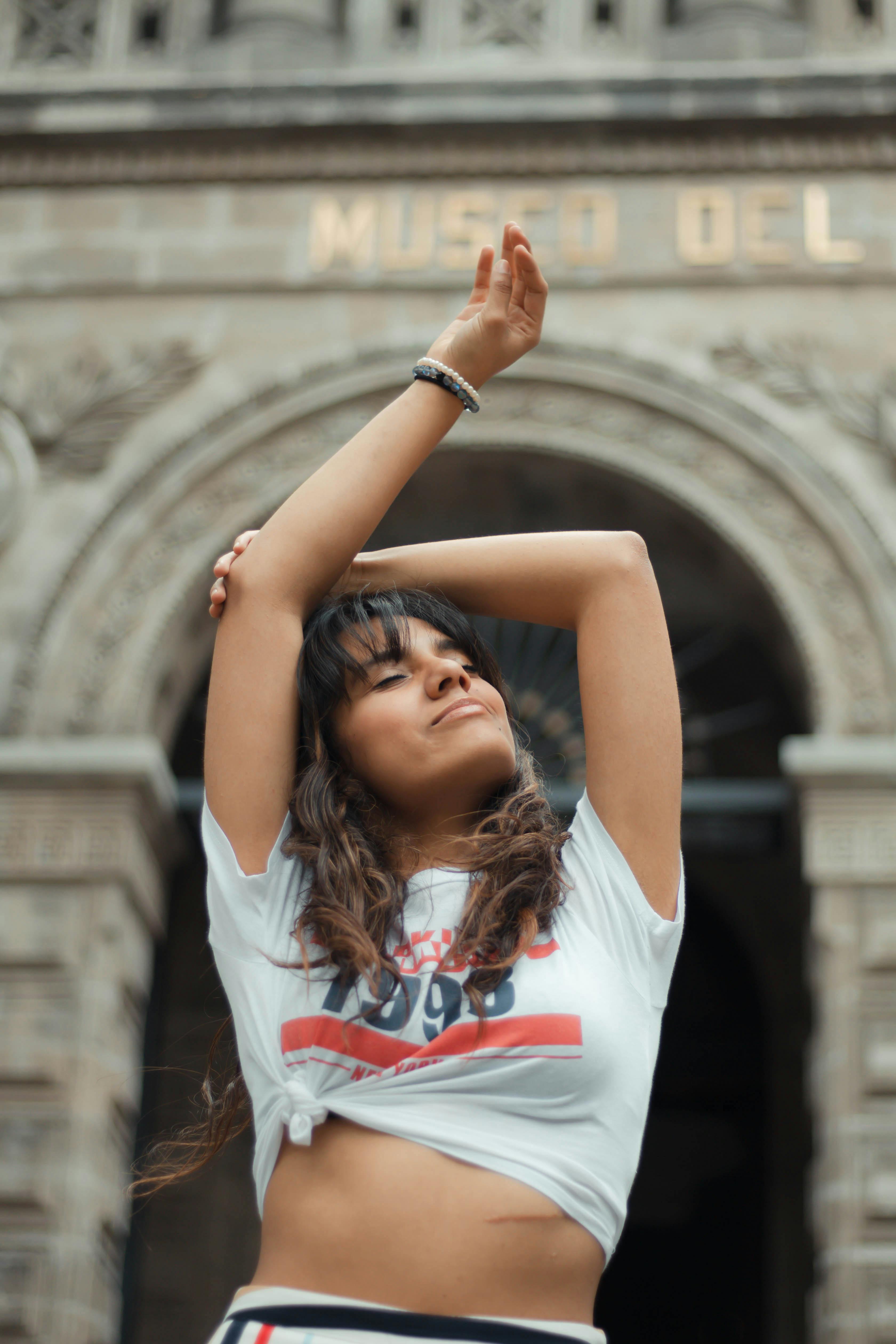Woman Dancing with Arms above her Head · Free Stock Photo