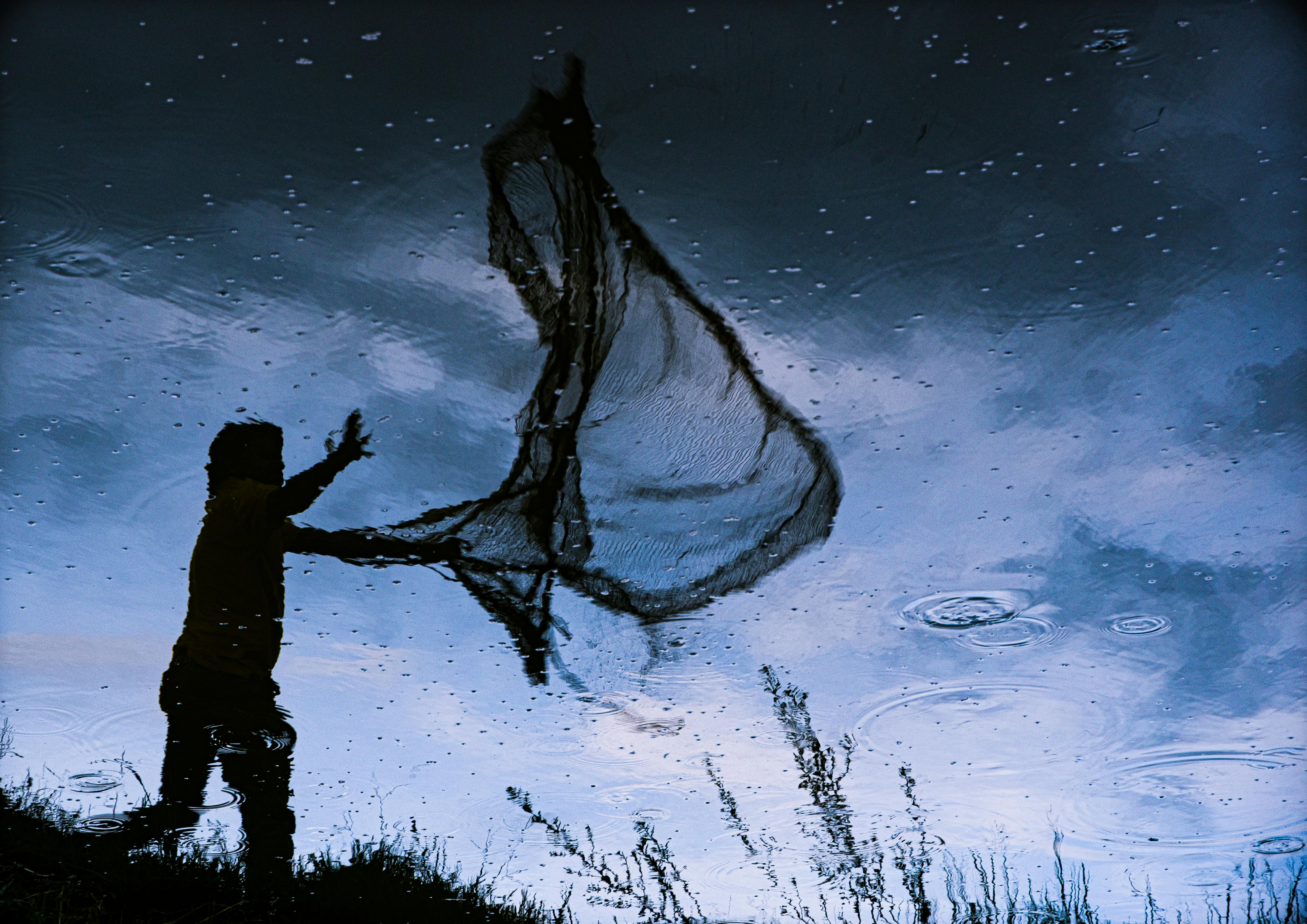 Reflection of a Person in Water · Free Stock Photo