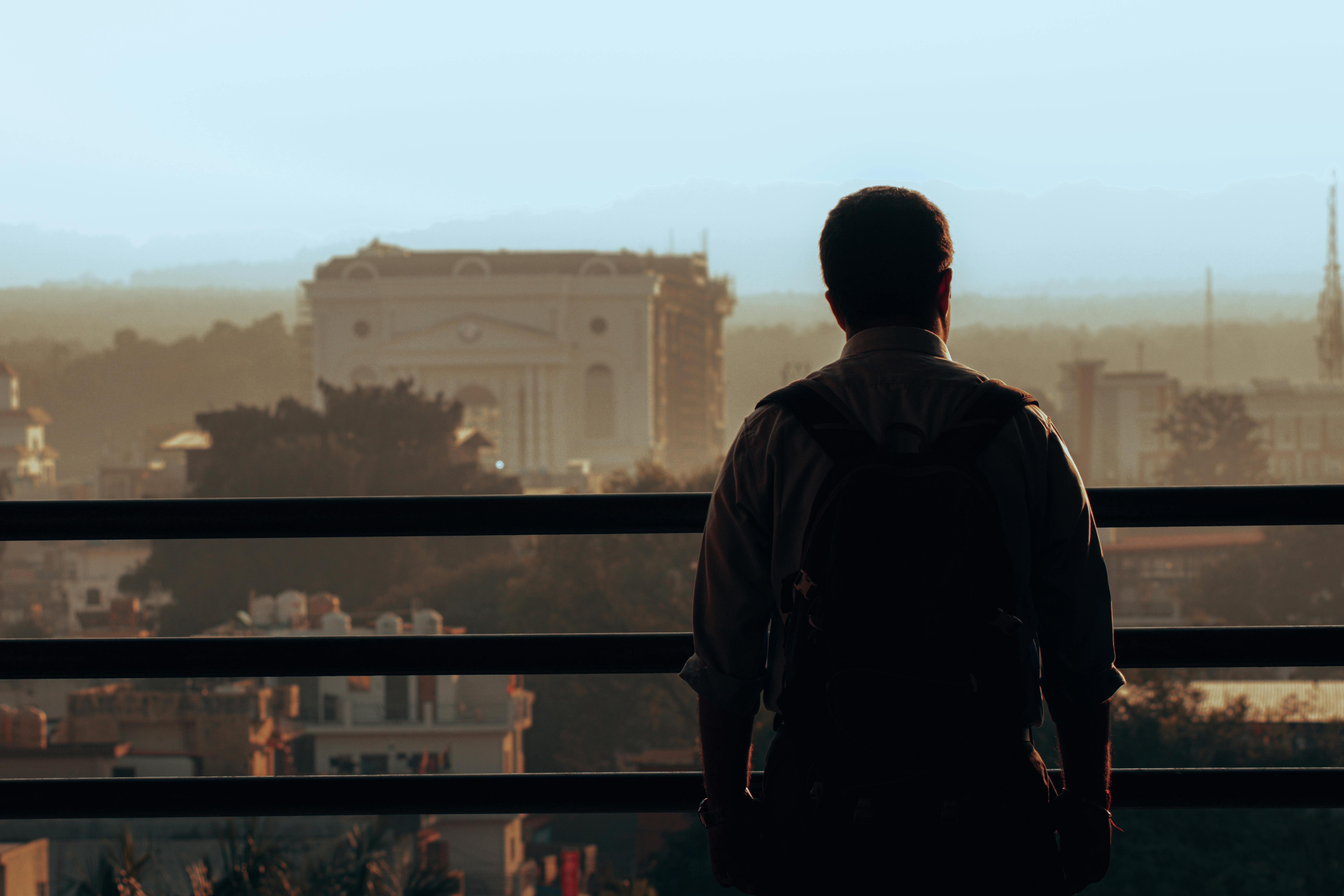 Silhouette of Man Looking at the City · Free Stock Photo