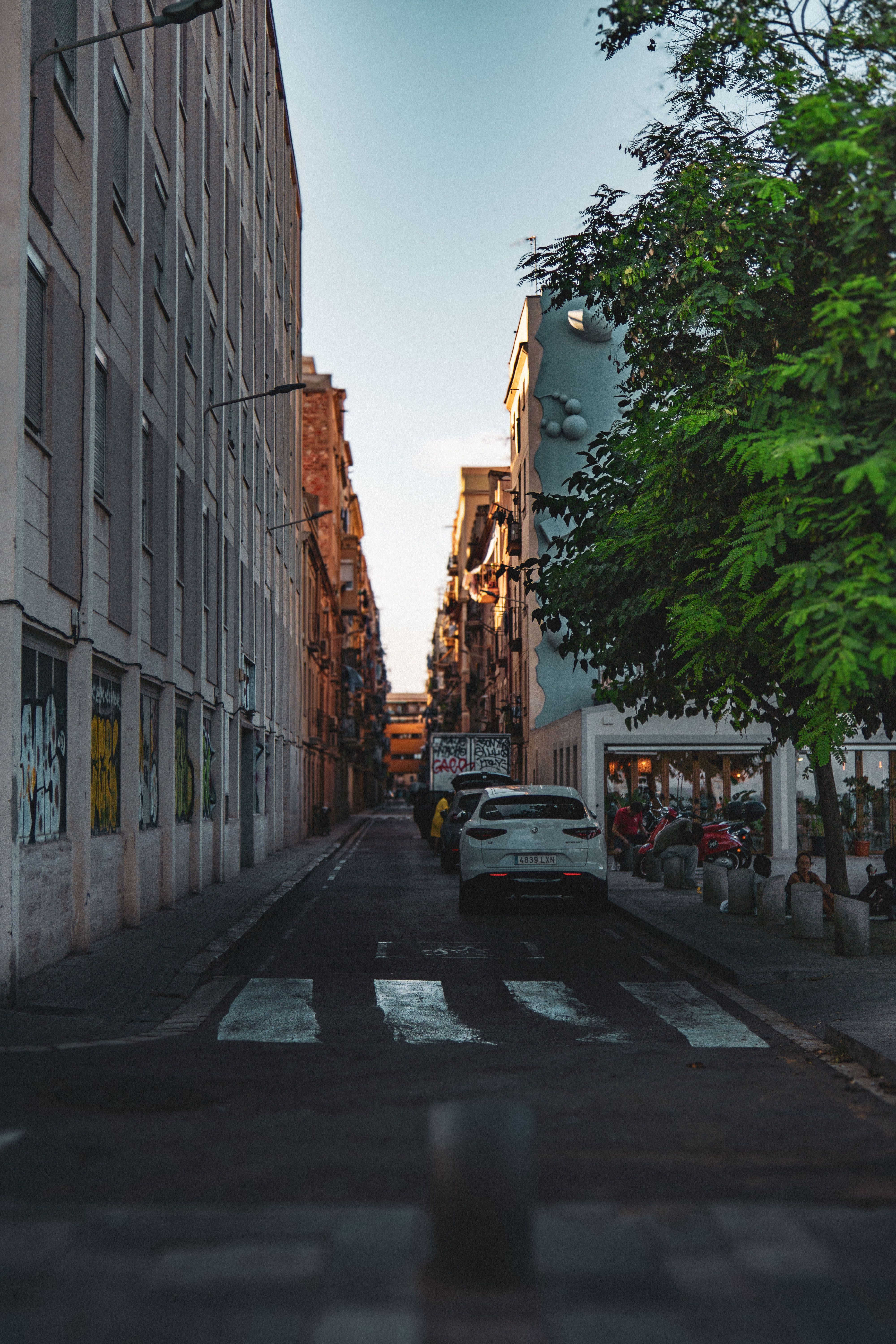 Symmetrical View of a Street between Buildings in City · Free Stock Photo