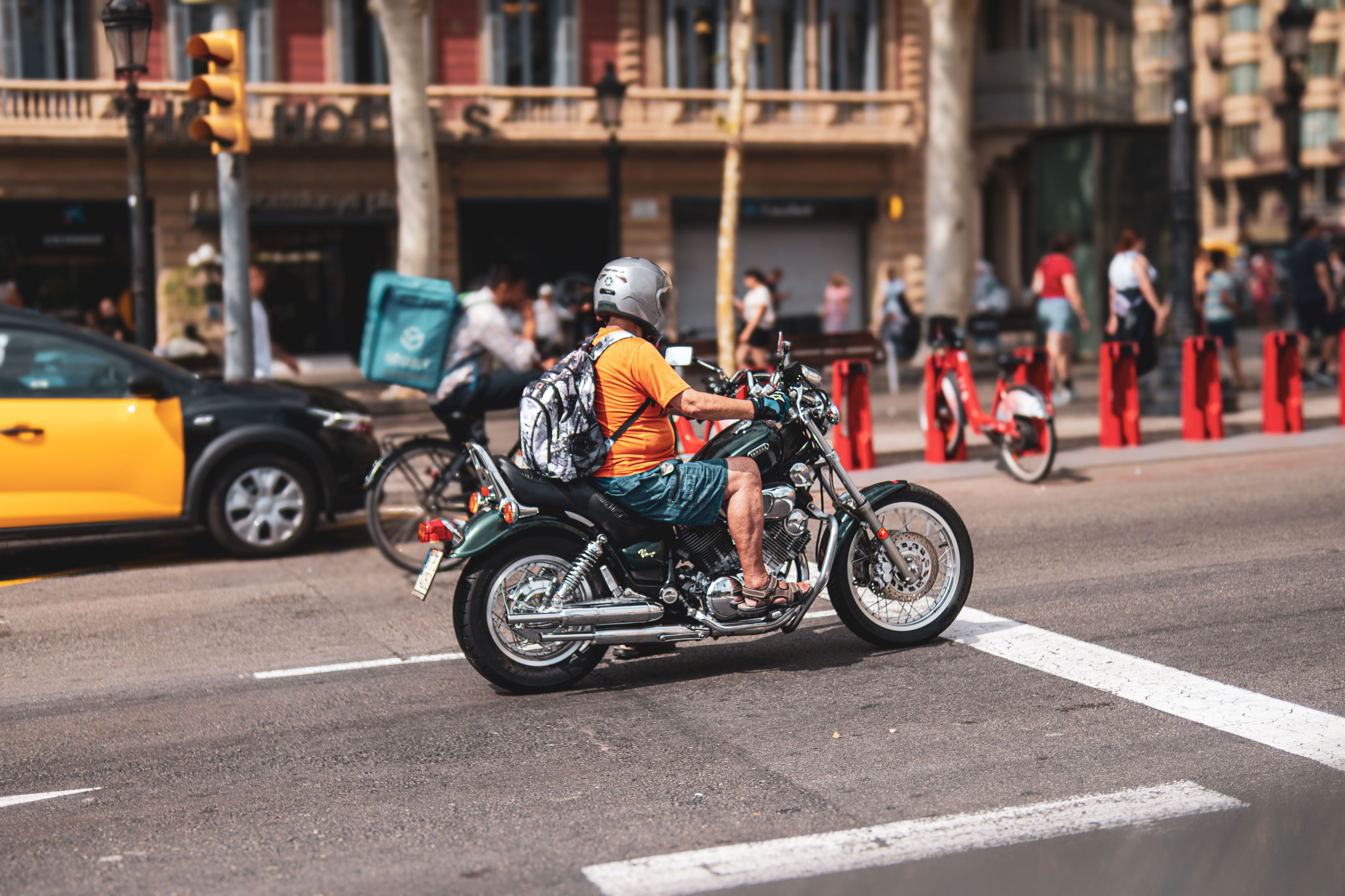 Motorcyclist with Helmet on Street · Free Stock Photo