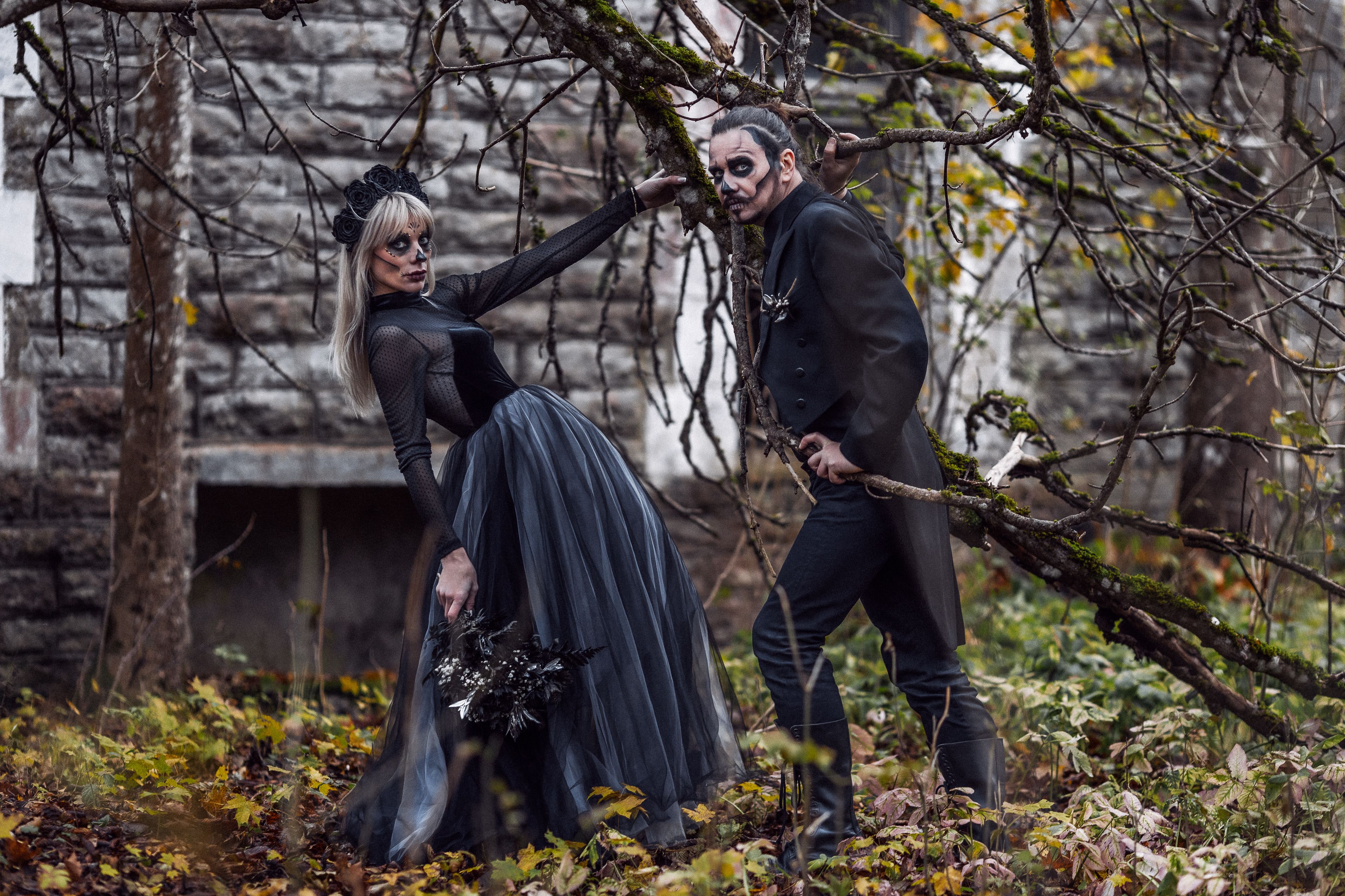 A Group of Men Wearing Goth Style Clothes and Makeup Laughing in front ...