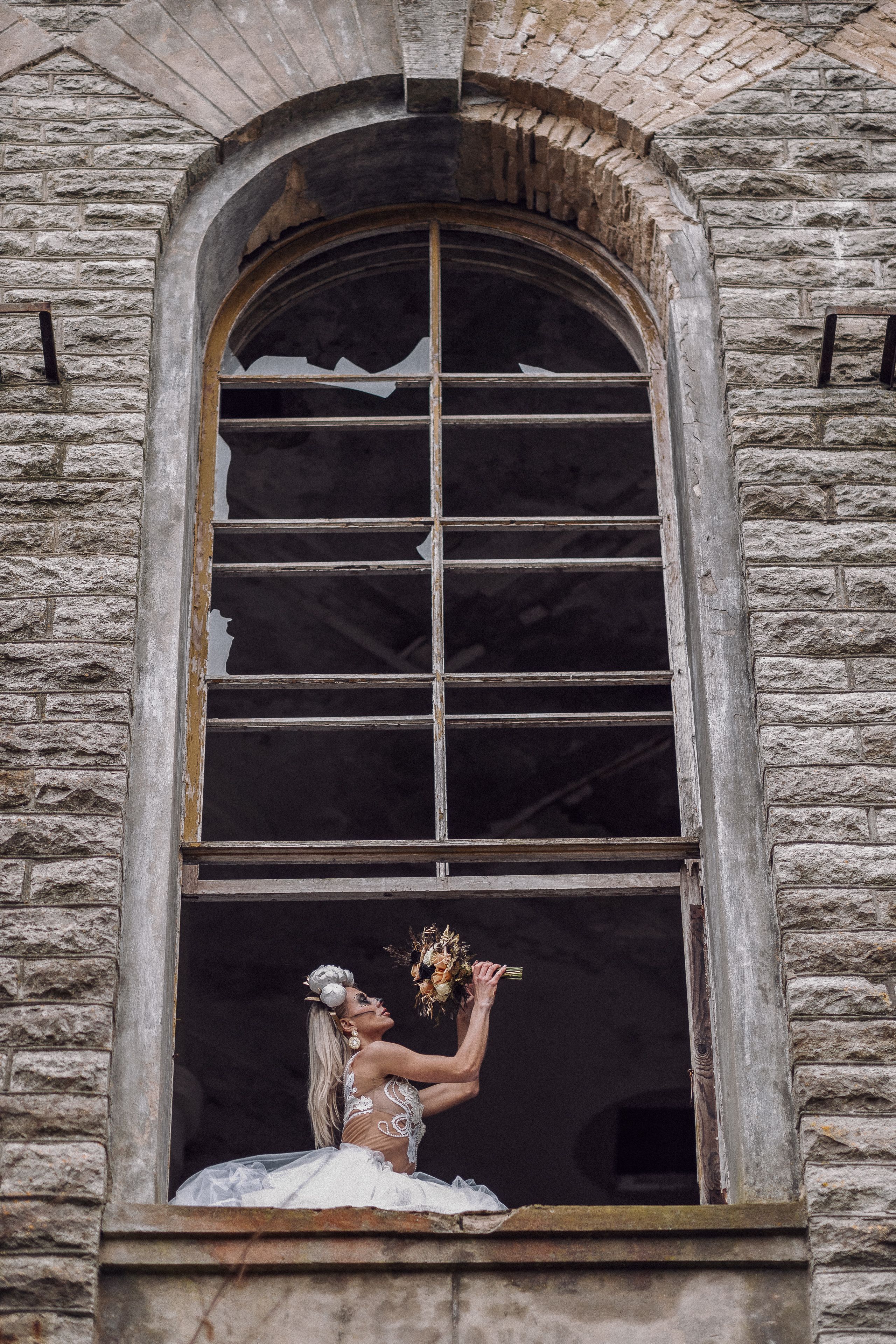 Woman Wearing a Costume in a Window · Free Stock Photo