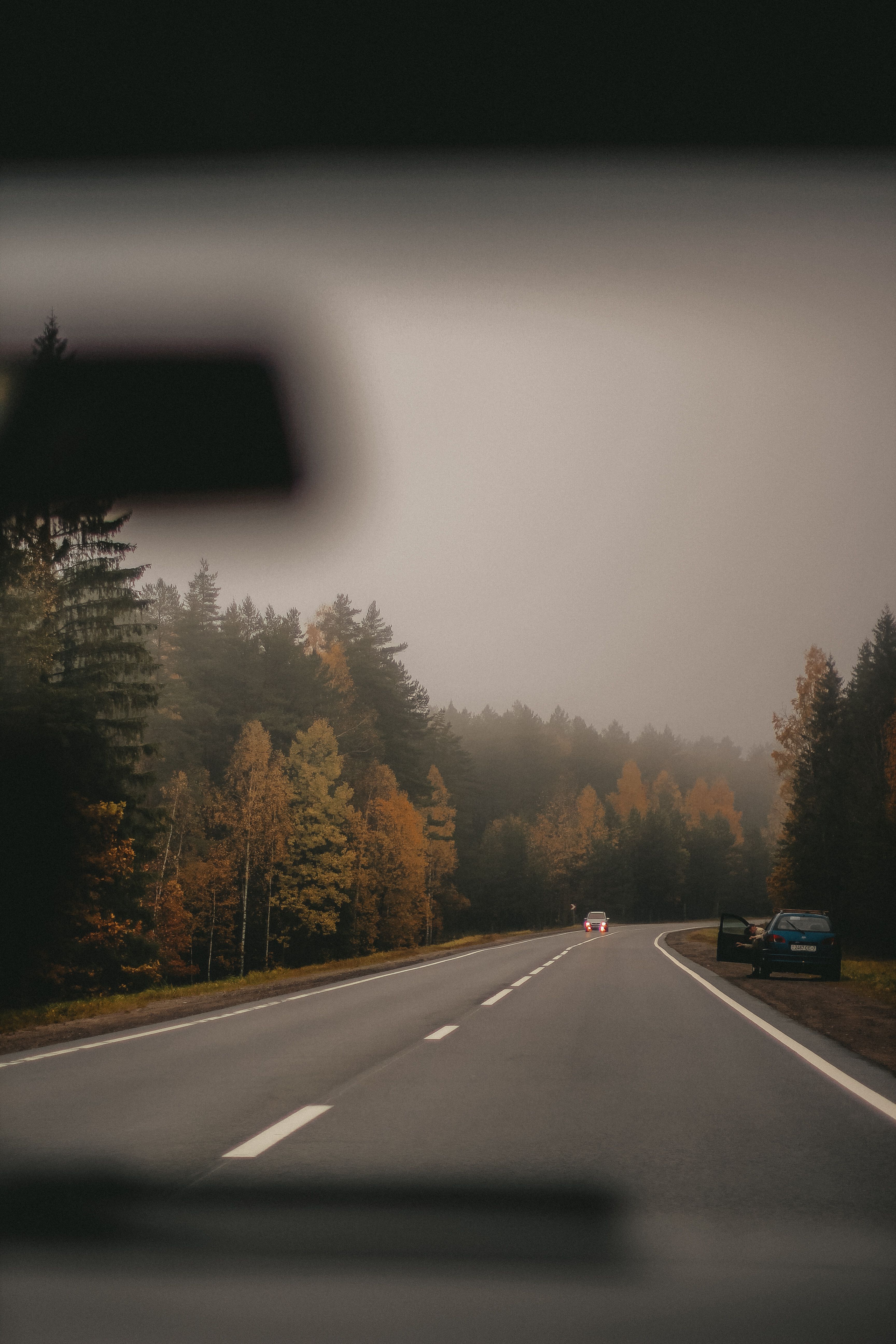 Driver Getting Out of the Car Parked on the Side of the Road by the ...