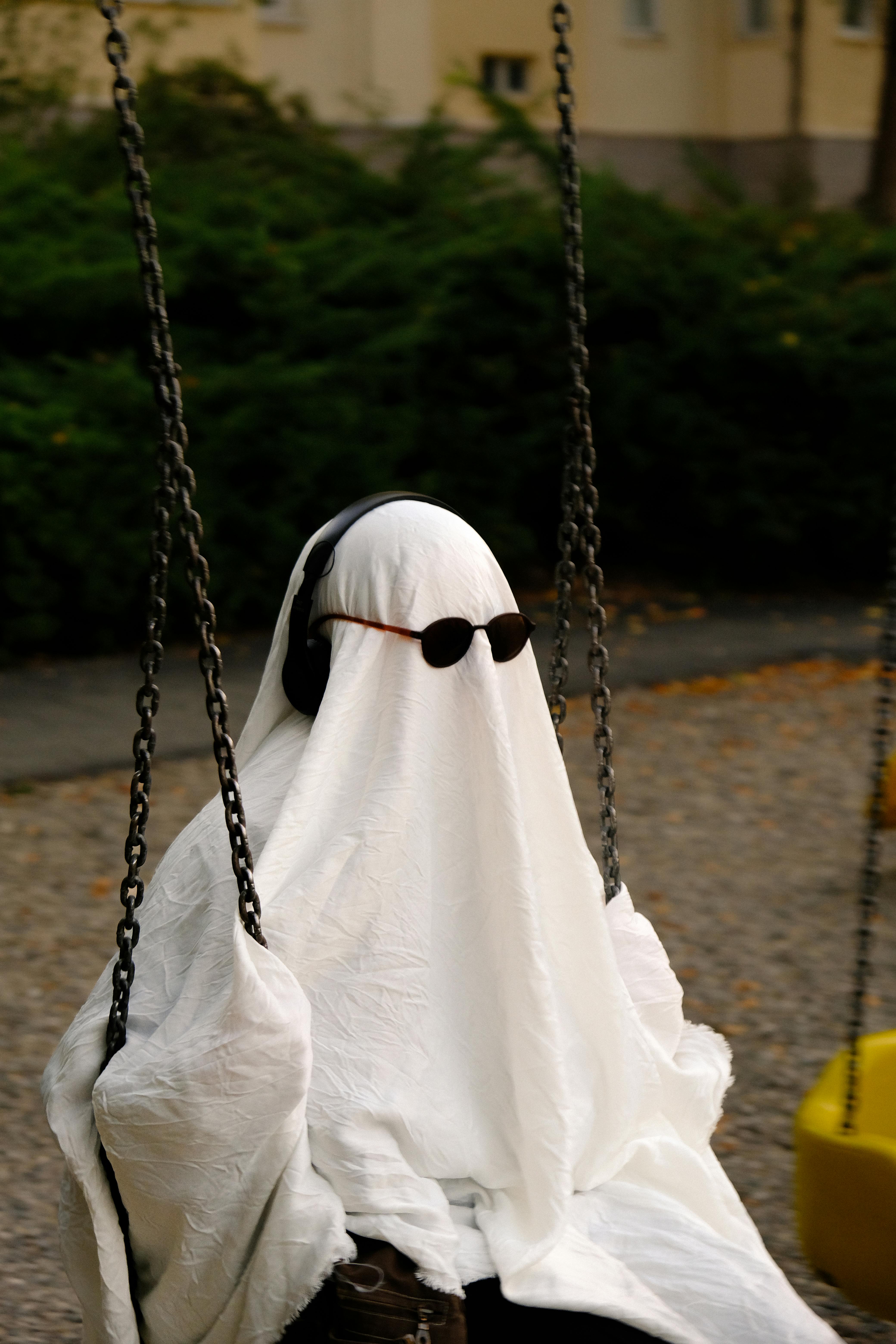Ghost in Sunglasses and Headphones on a Swing · Free Stock Photo