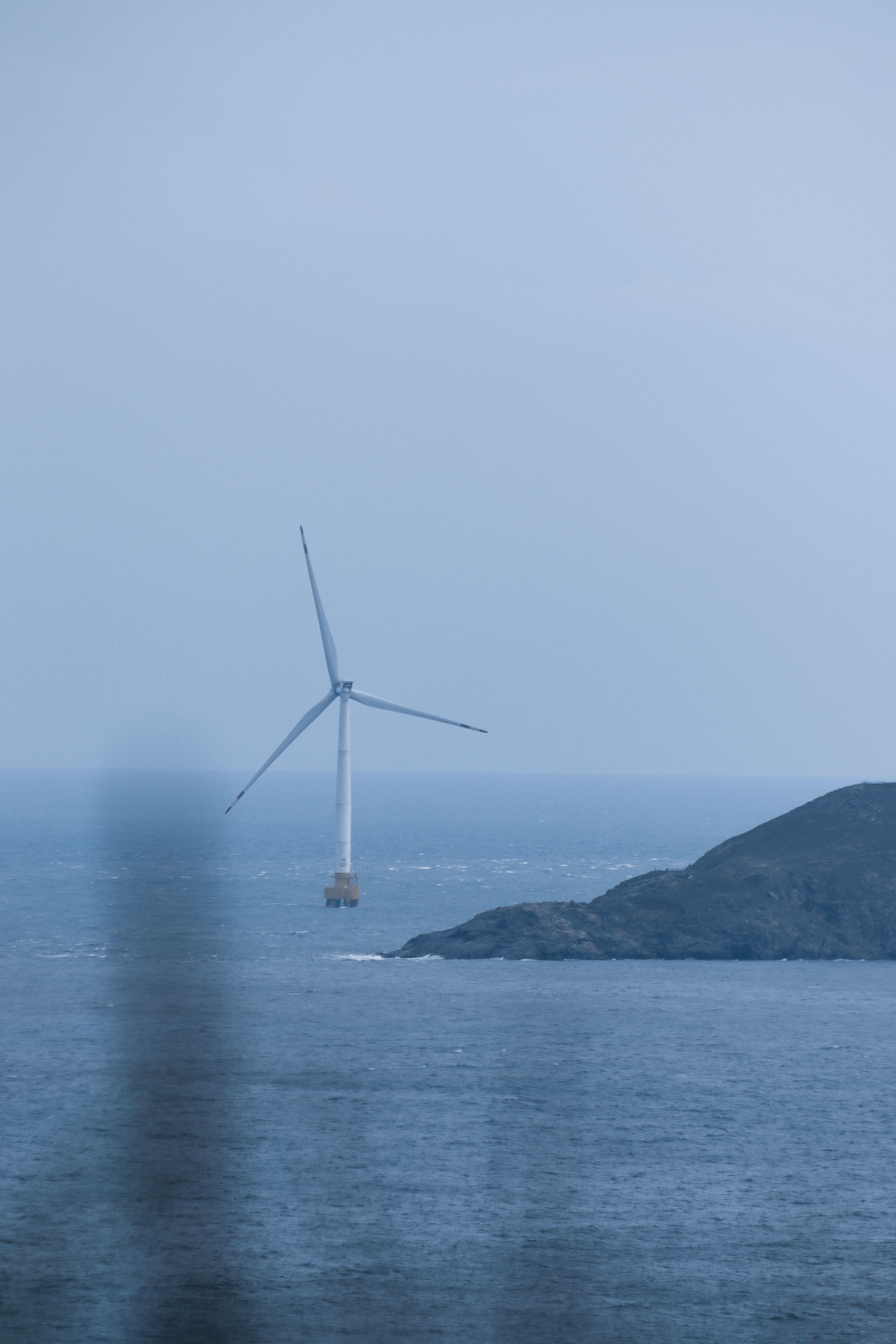 Windmill in a Sea · Free Stock Photo