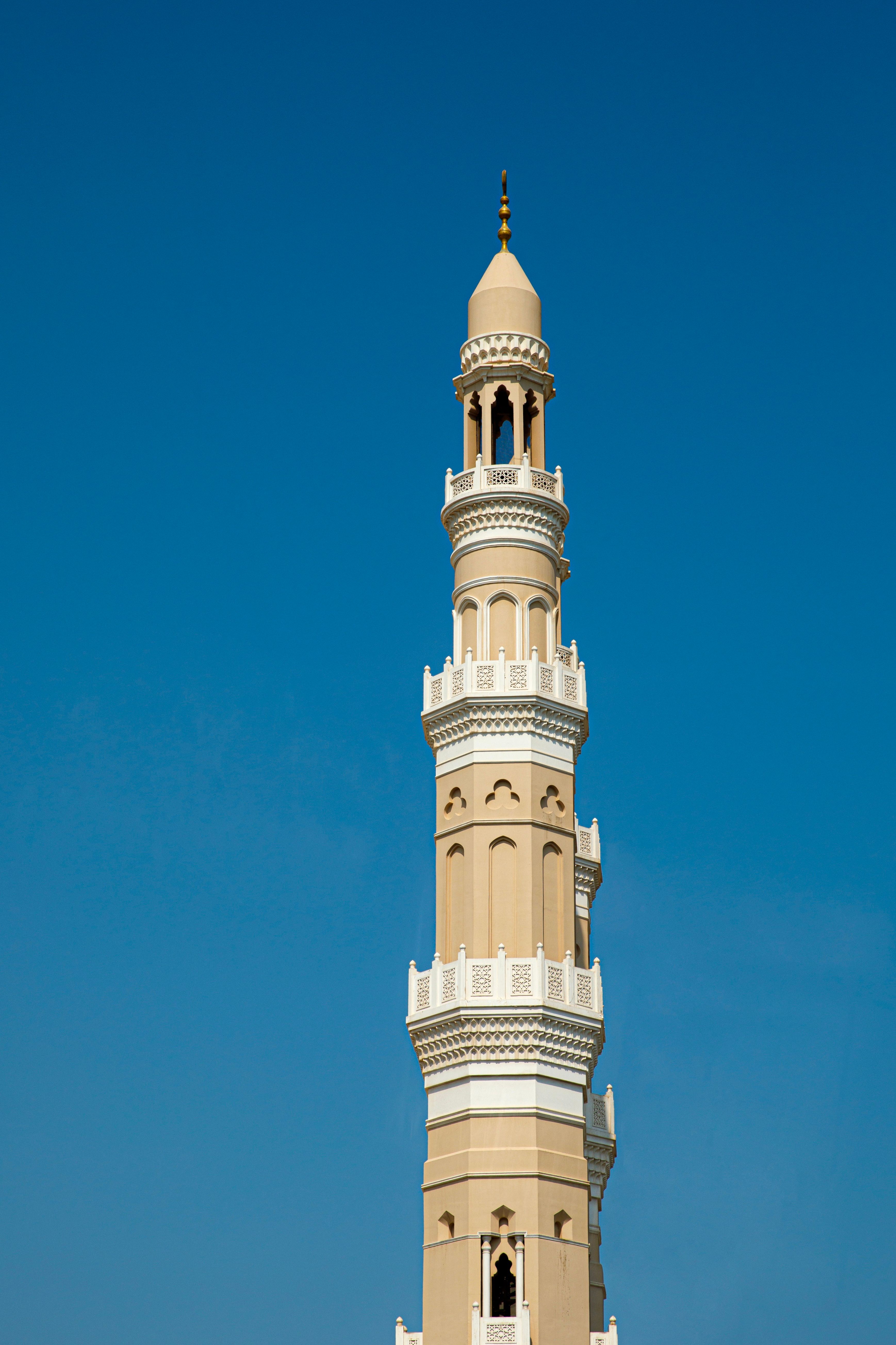 Top of the Minaret Tower Against a Blue Sky Background · Free Stock Photo