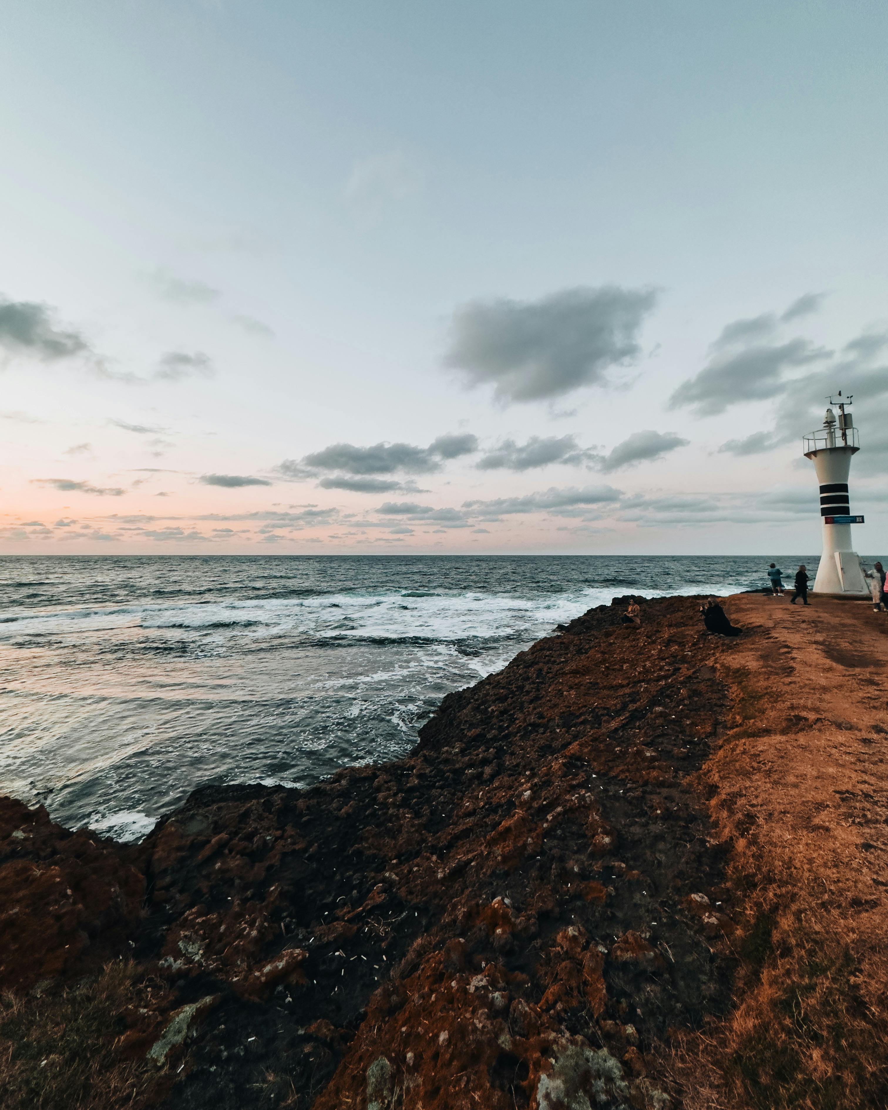 Aerial Photo of Lighthouse at Top of Cliff · Free Stock Photo