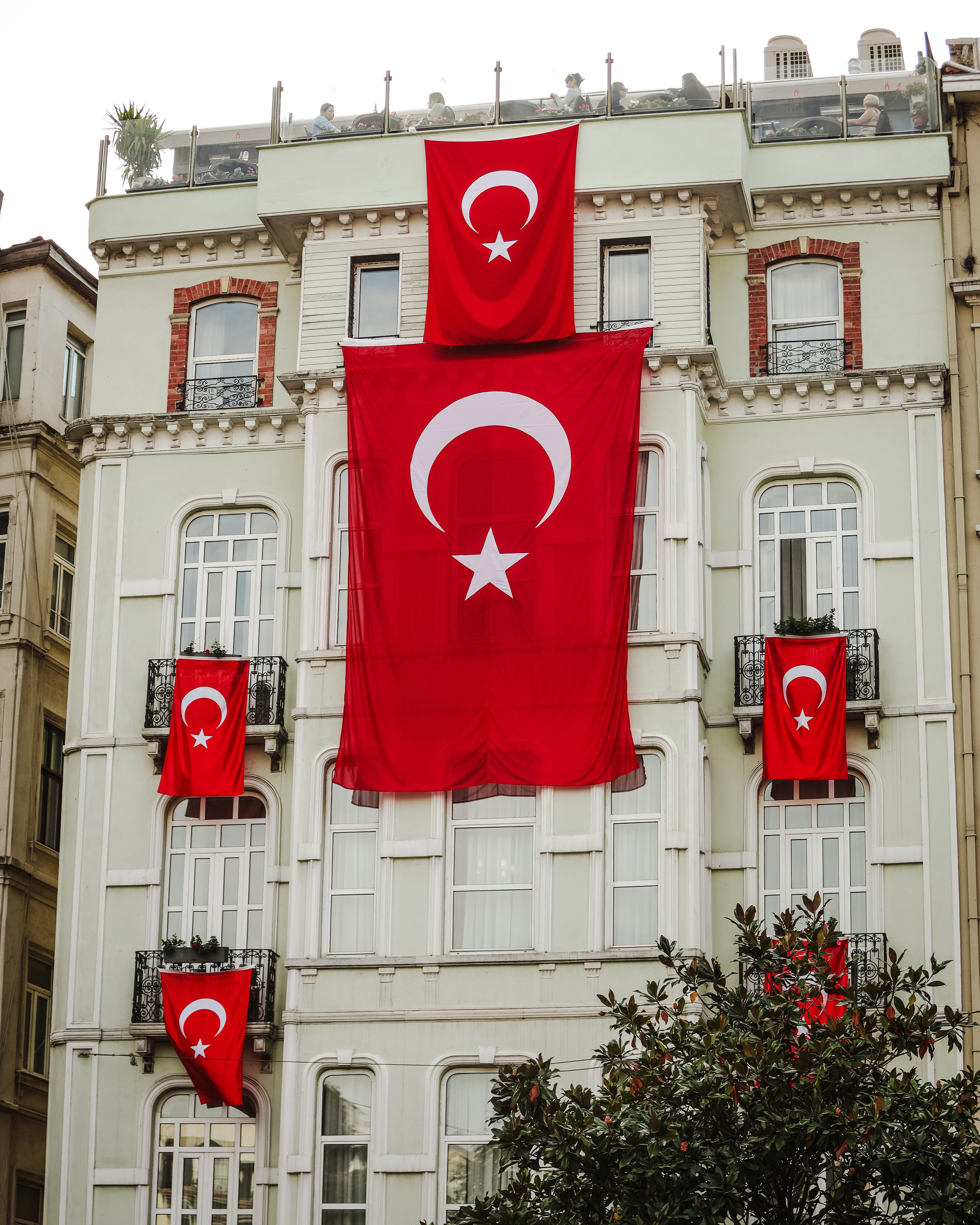 Flags on Wall of Residential Building in Turkey · Free Stock Photo