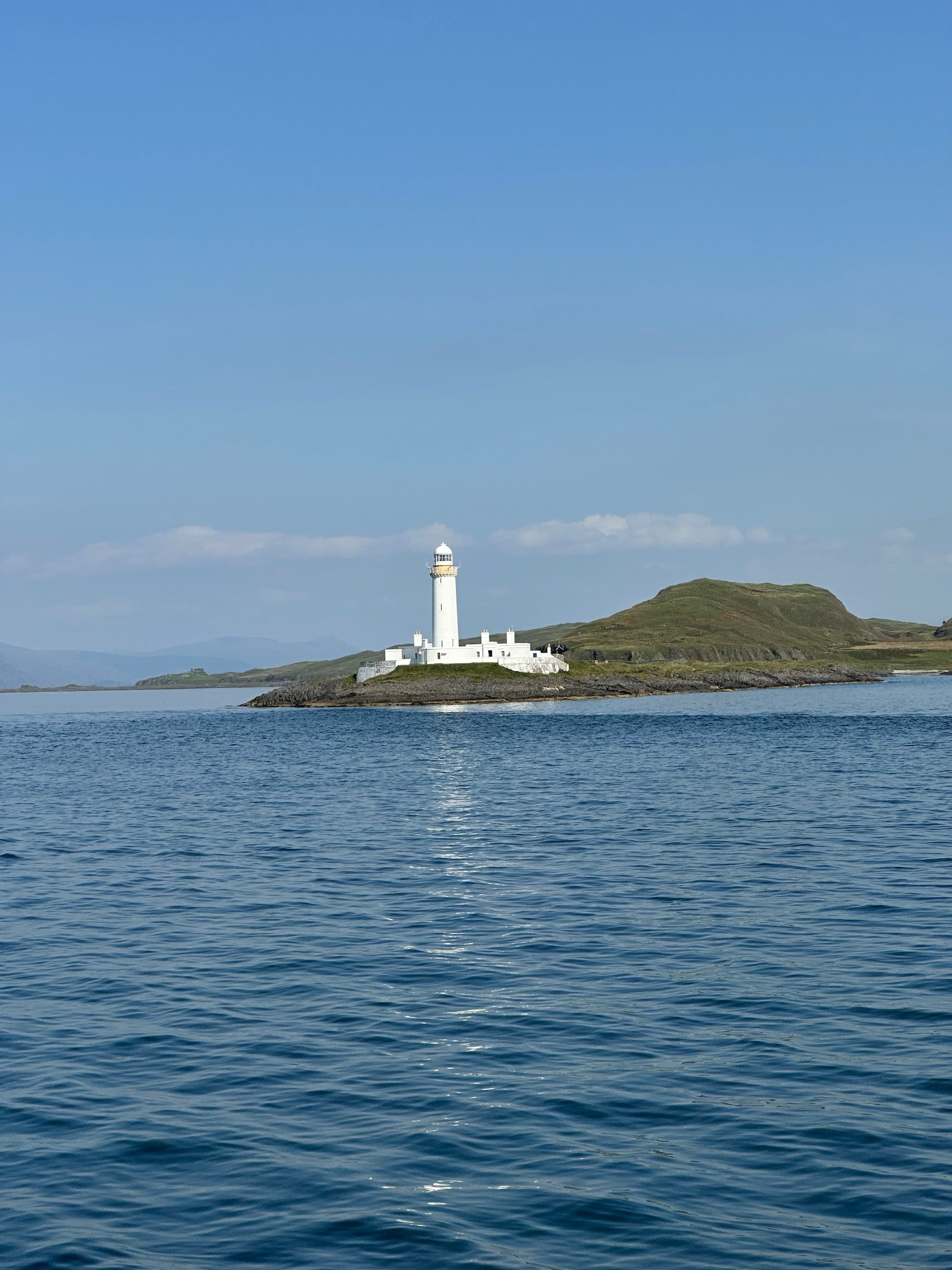Small White Lighthouse on a Rocky Islet in a Norwegian Fjord · Free ...