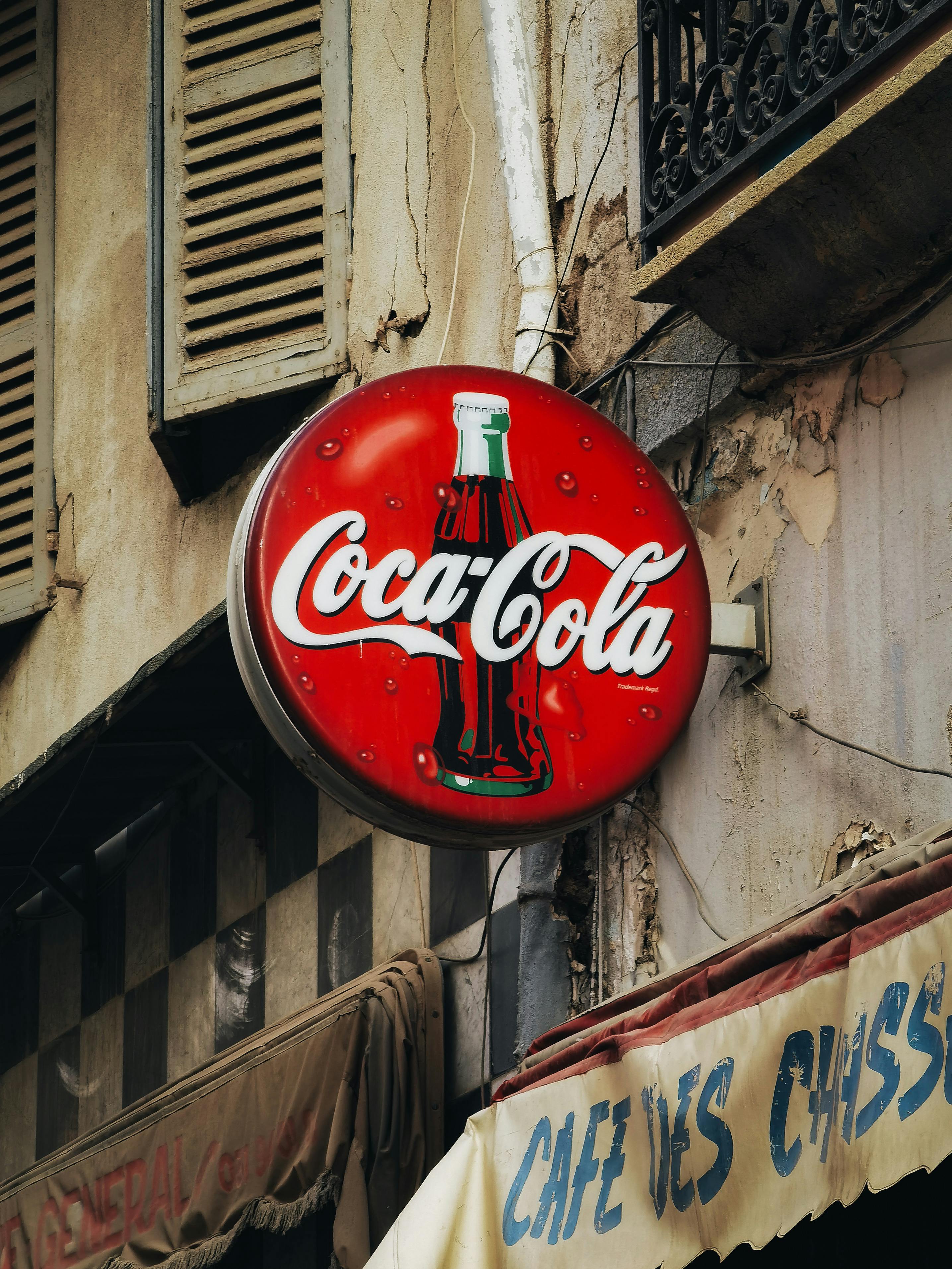 Drug Store Drink Coca Cola Signage on Gray Wooden Wall · Free Stock Photo