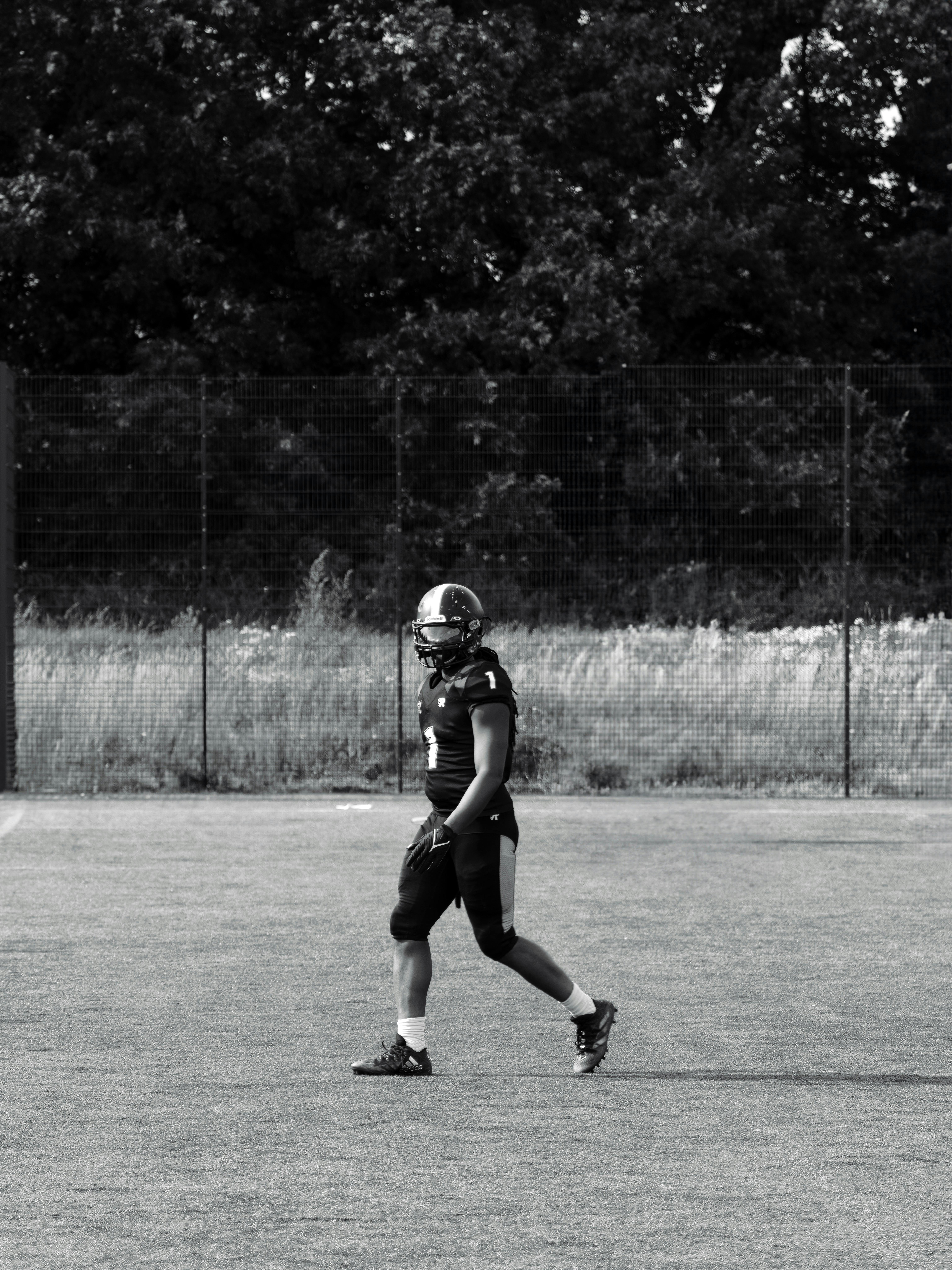 Man Playing Football in Black and White · Free Stock Photo