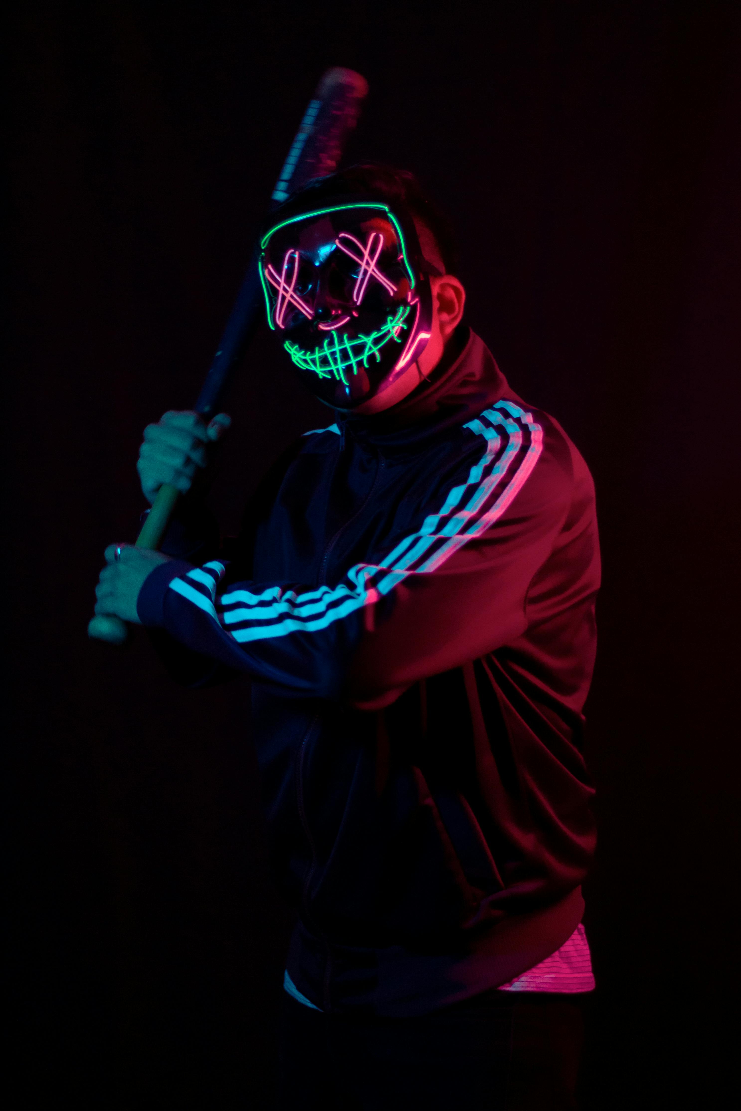 A Man Wearing an LED Halloween Mask and Holding a Baseball Bat · Free ...
